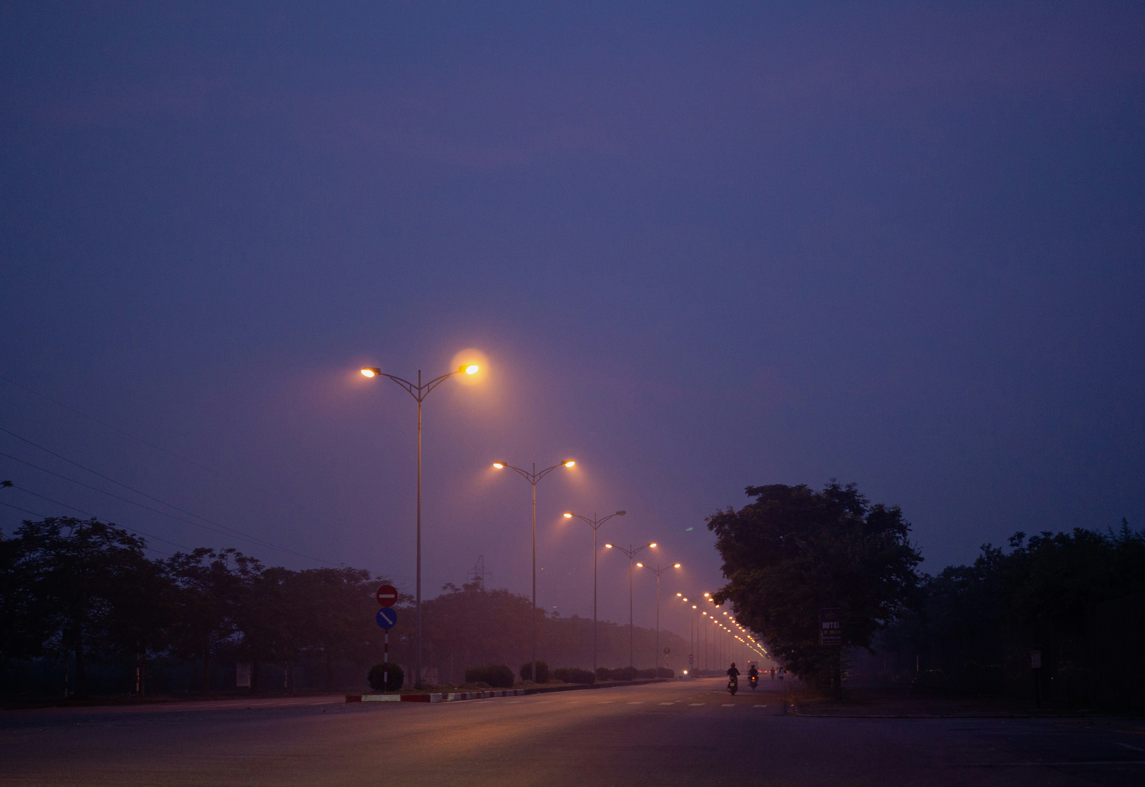 Evening Roadway Lights Stretch into the Quiet Distance