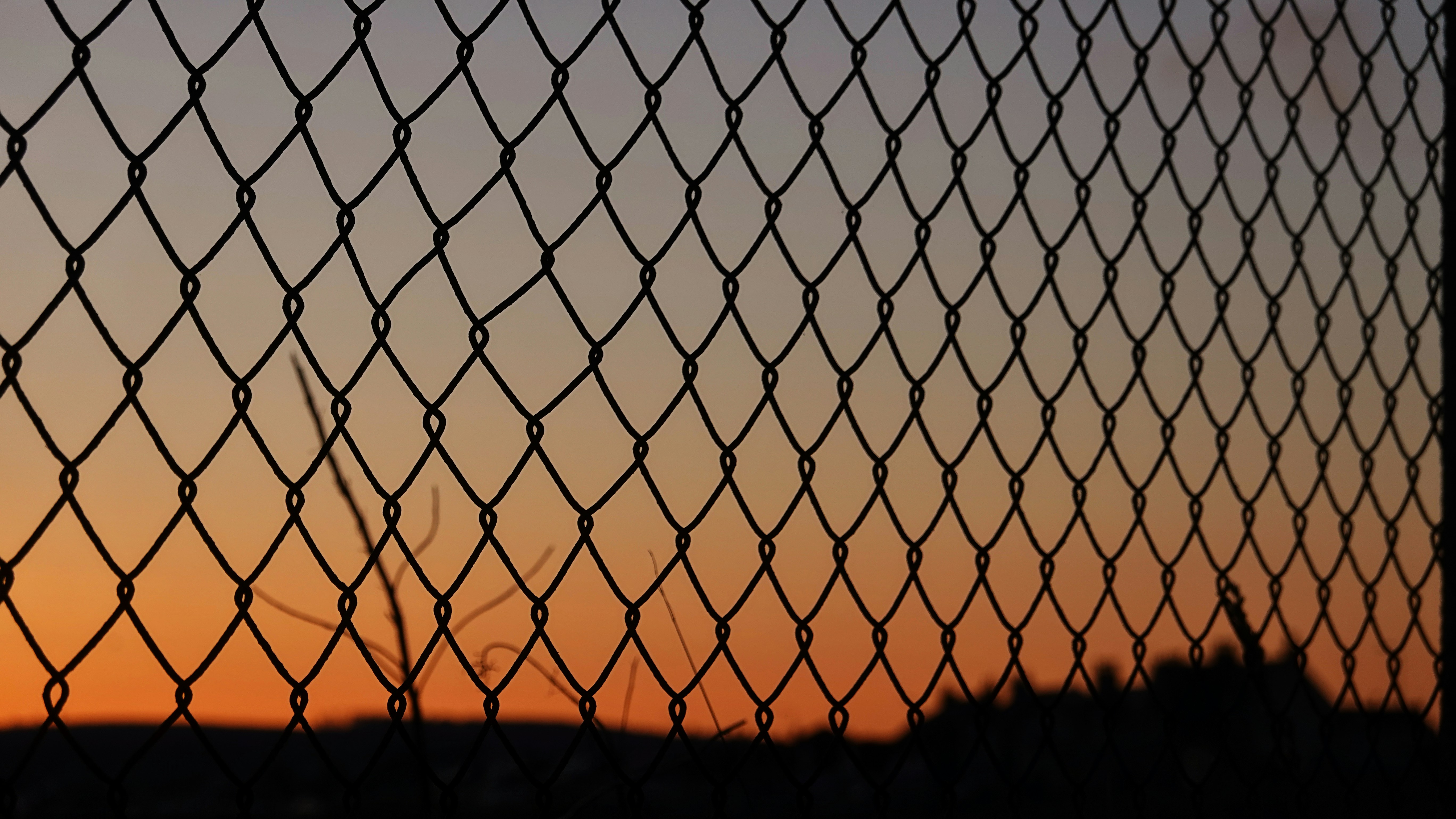 Sunset Behind a Folding Fence