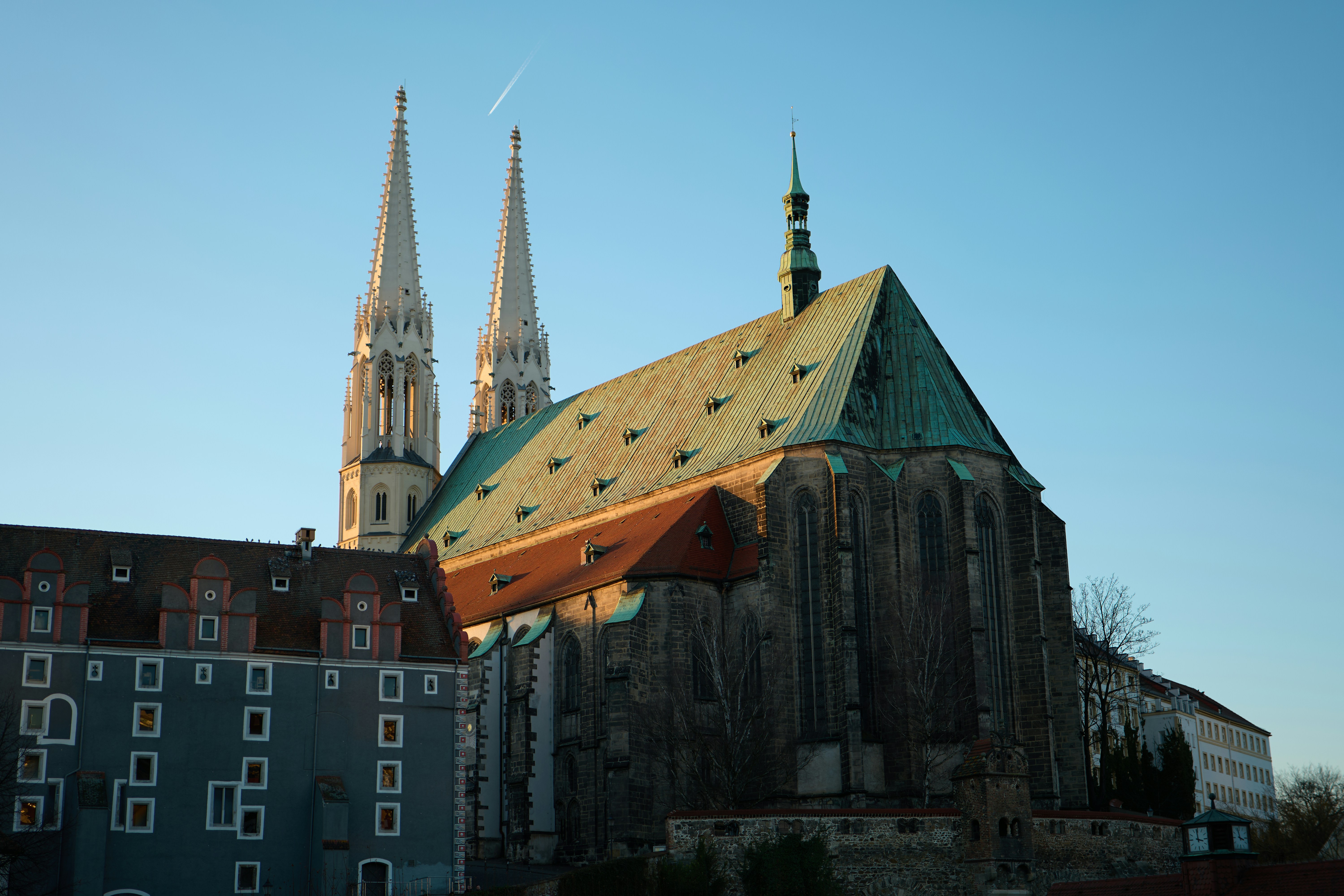 Golden Roof Overlook: A Gothic Basilica Under a Clear Noon Sky