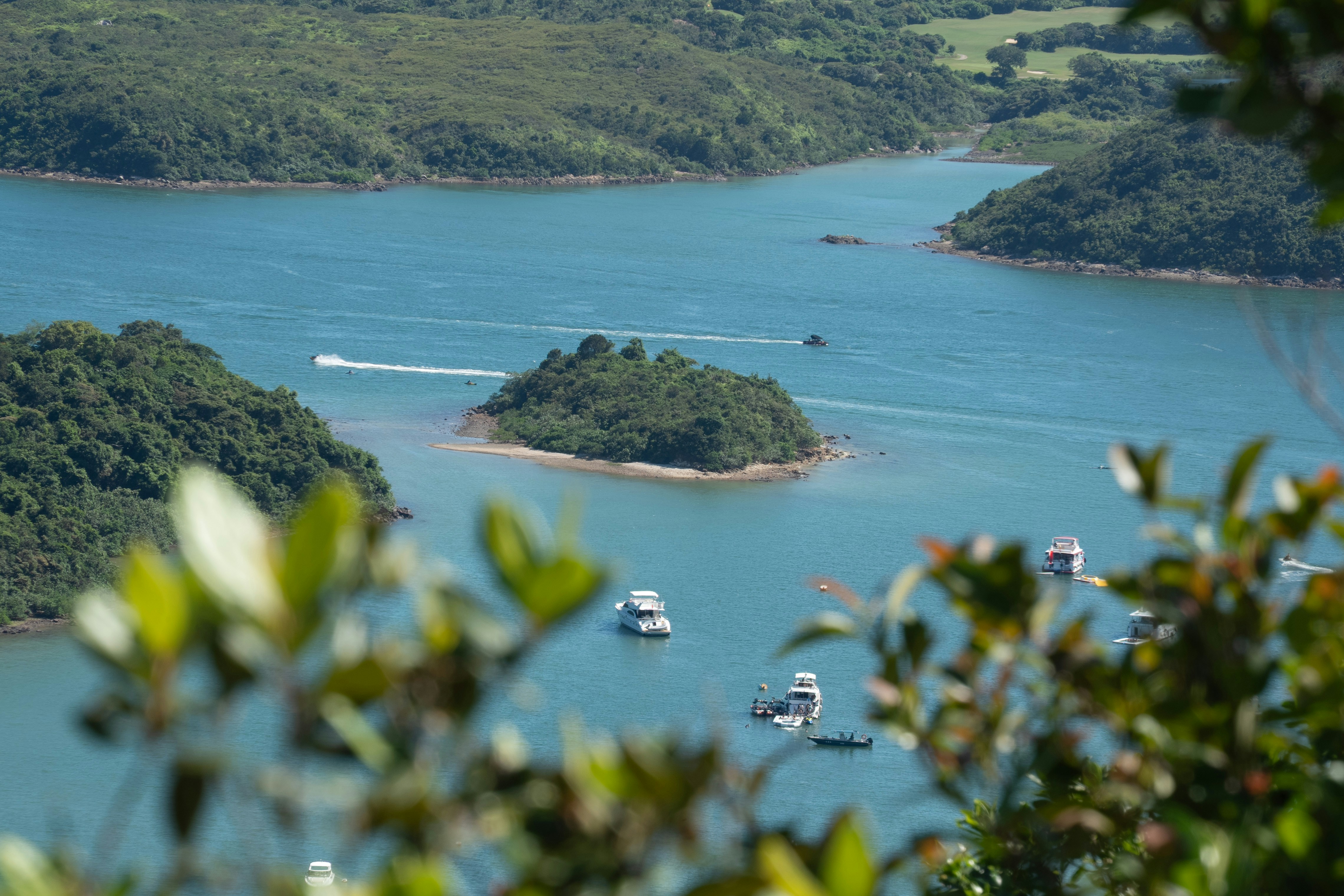 Azure channels and a hidden island amid a glassy bay