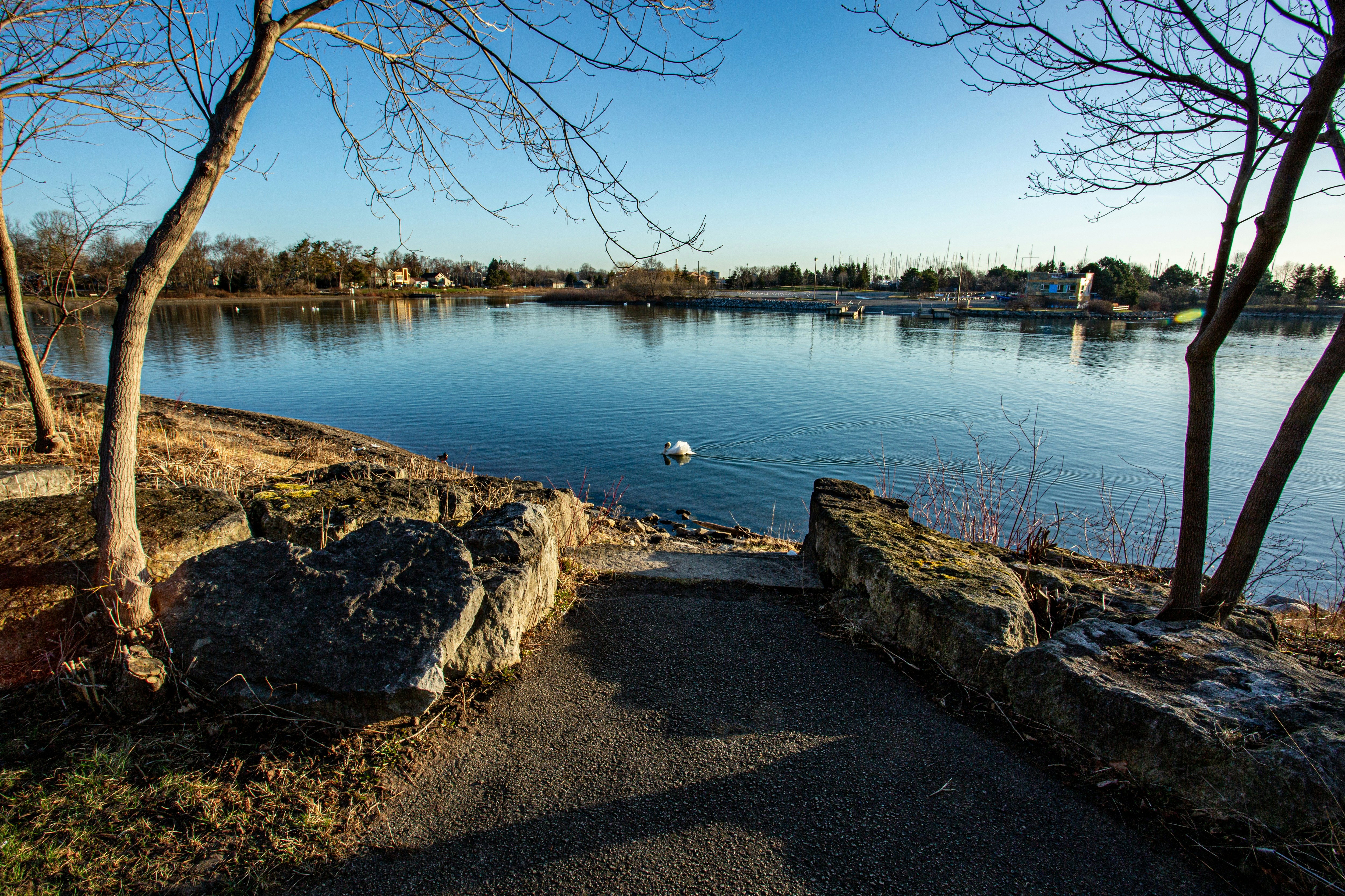 Riverwalk Vista: Sunset Light Over Calm Waters