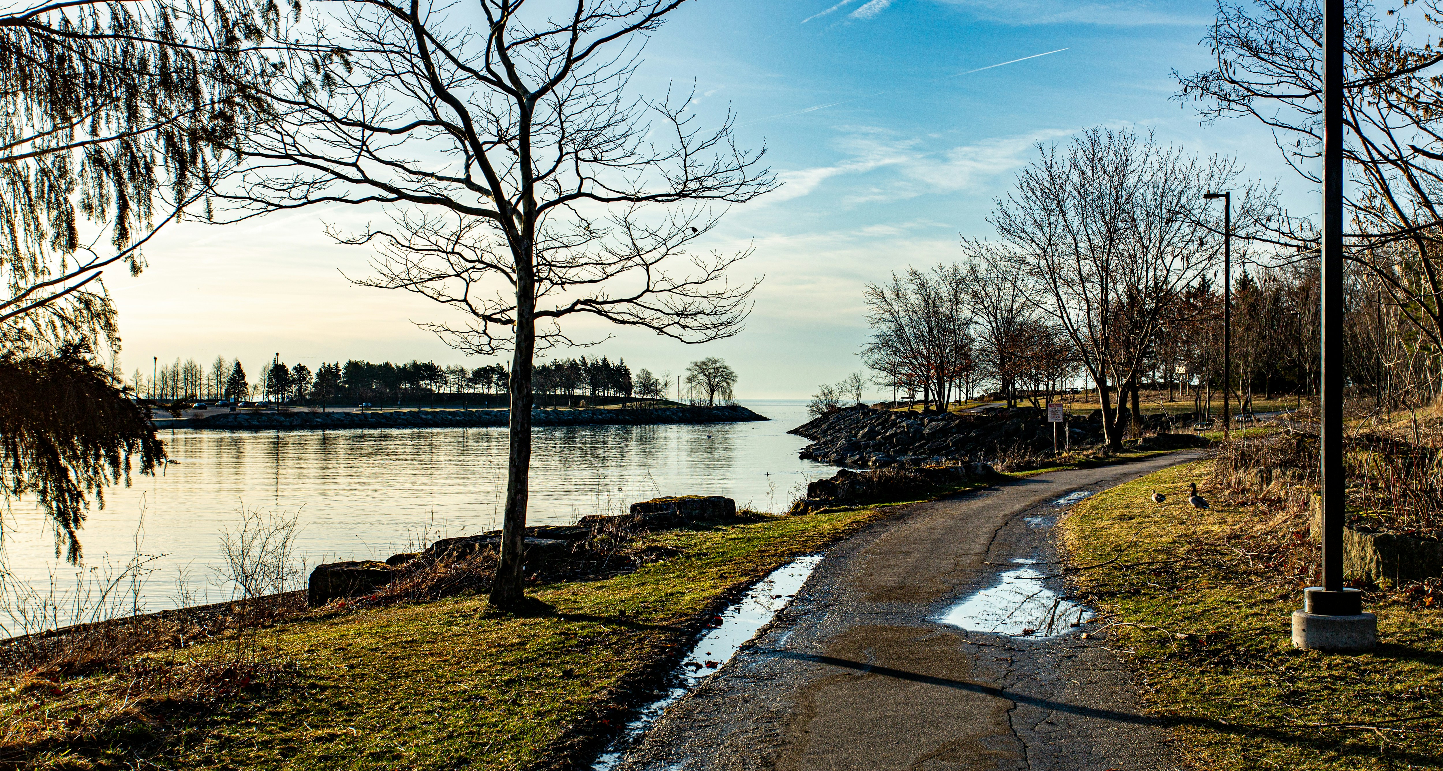 Lakeside Pathway at Dusk: A Quiet Riverbend by the Water