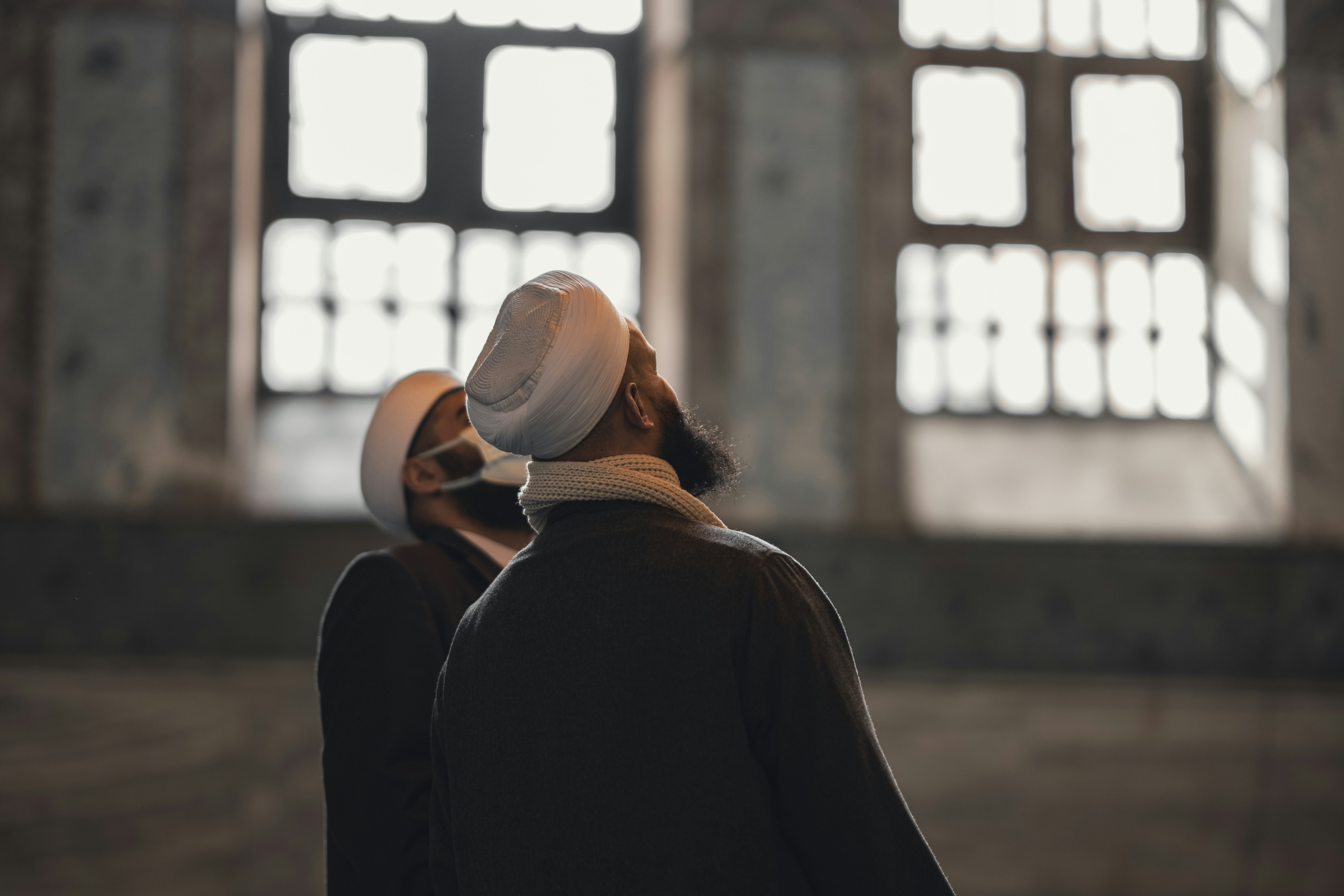 Two Heads, One Quiet Moment: A Masked Encounter in the Cathedral Glass Light
