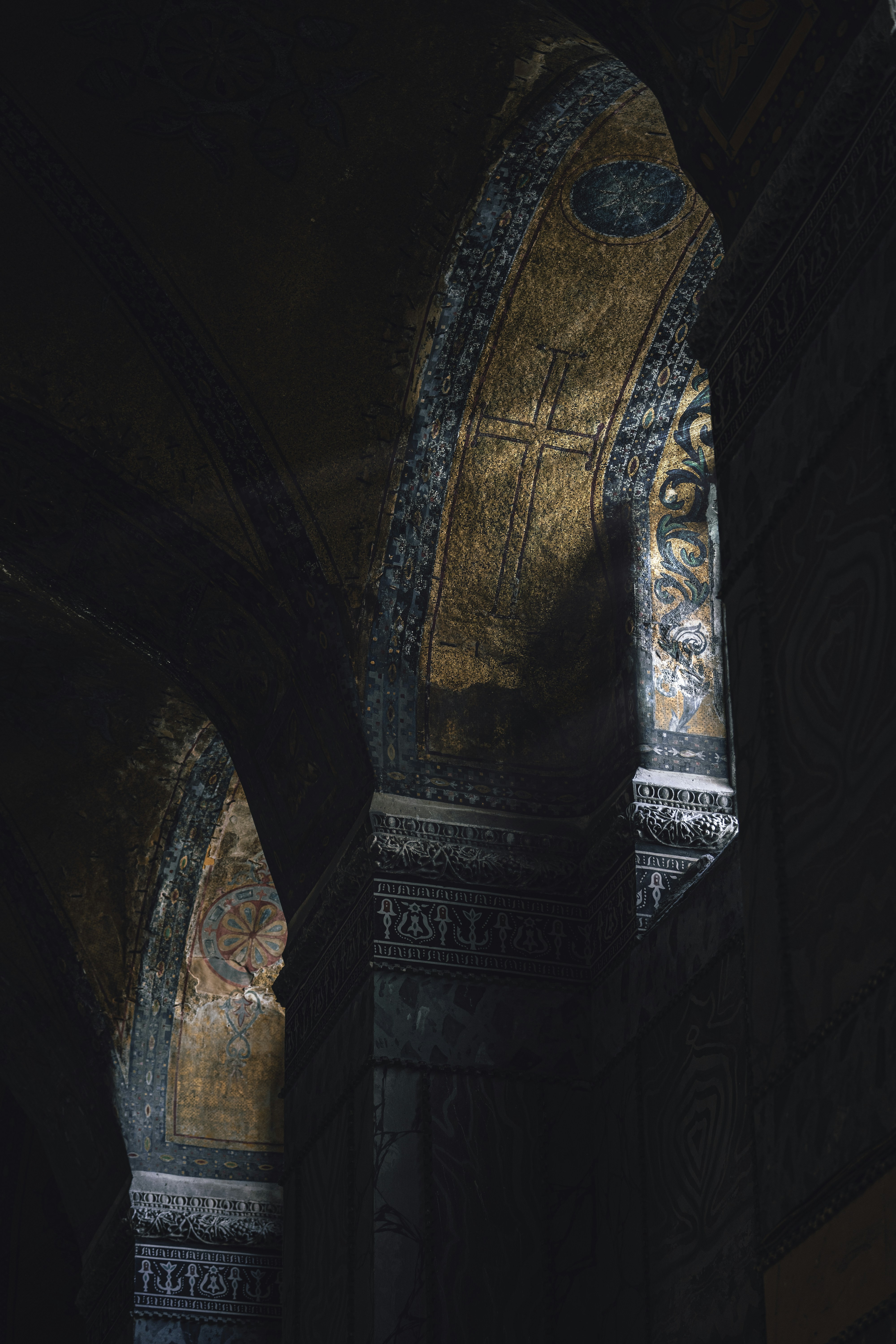 Shadowed Arches: A Whisper of Painted Domes in Dim Light
