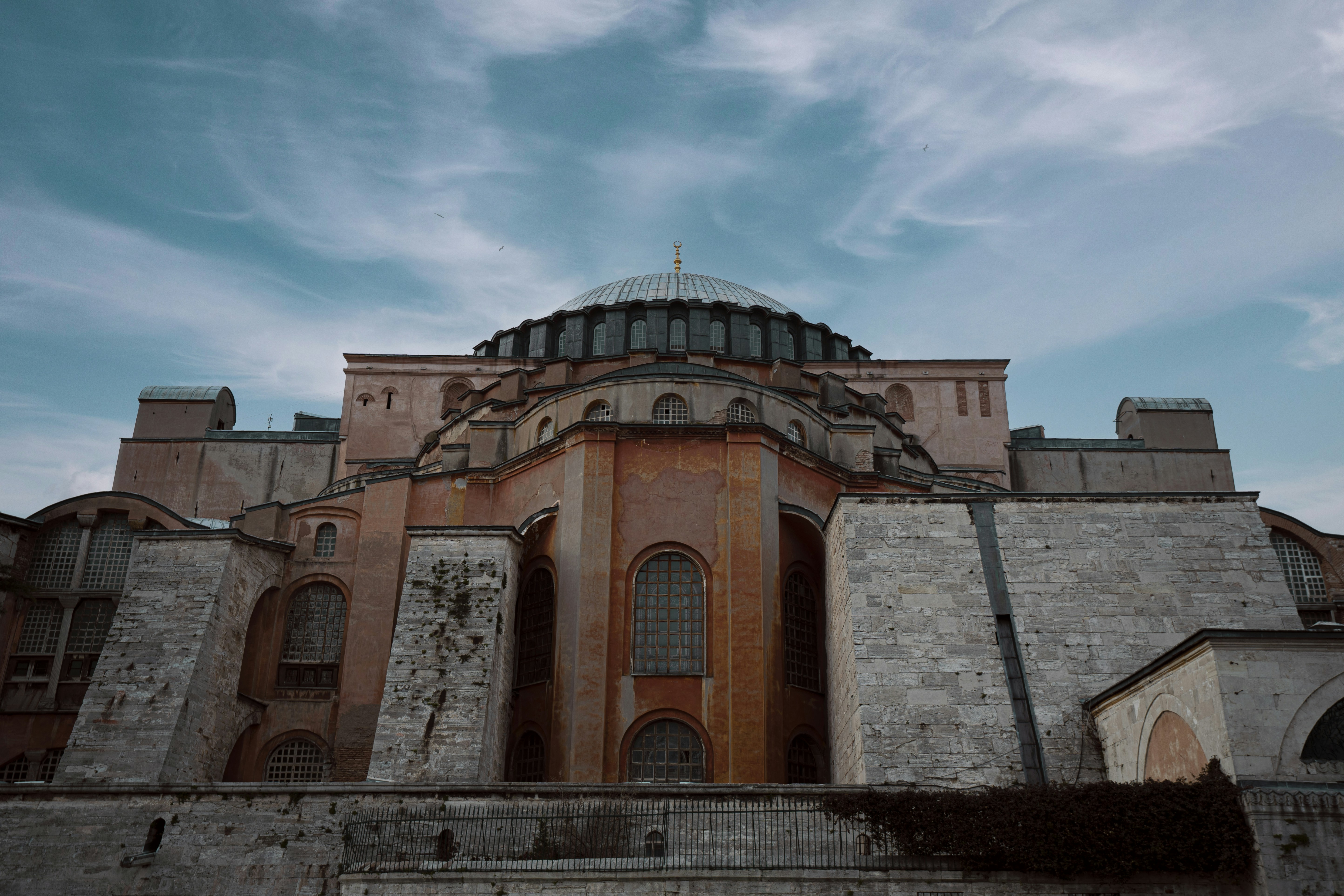 Ancient Domes and Stone: A Monumental Facade Under Clear Skies