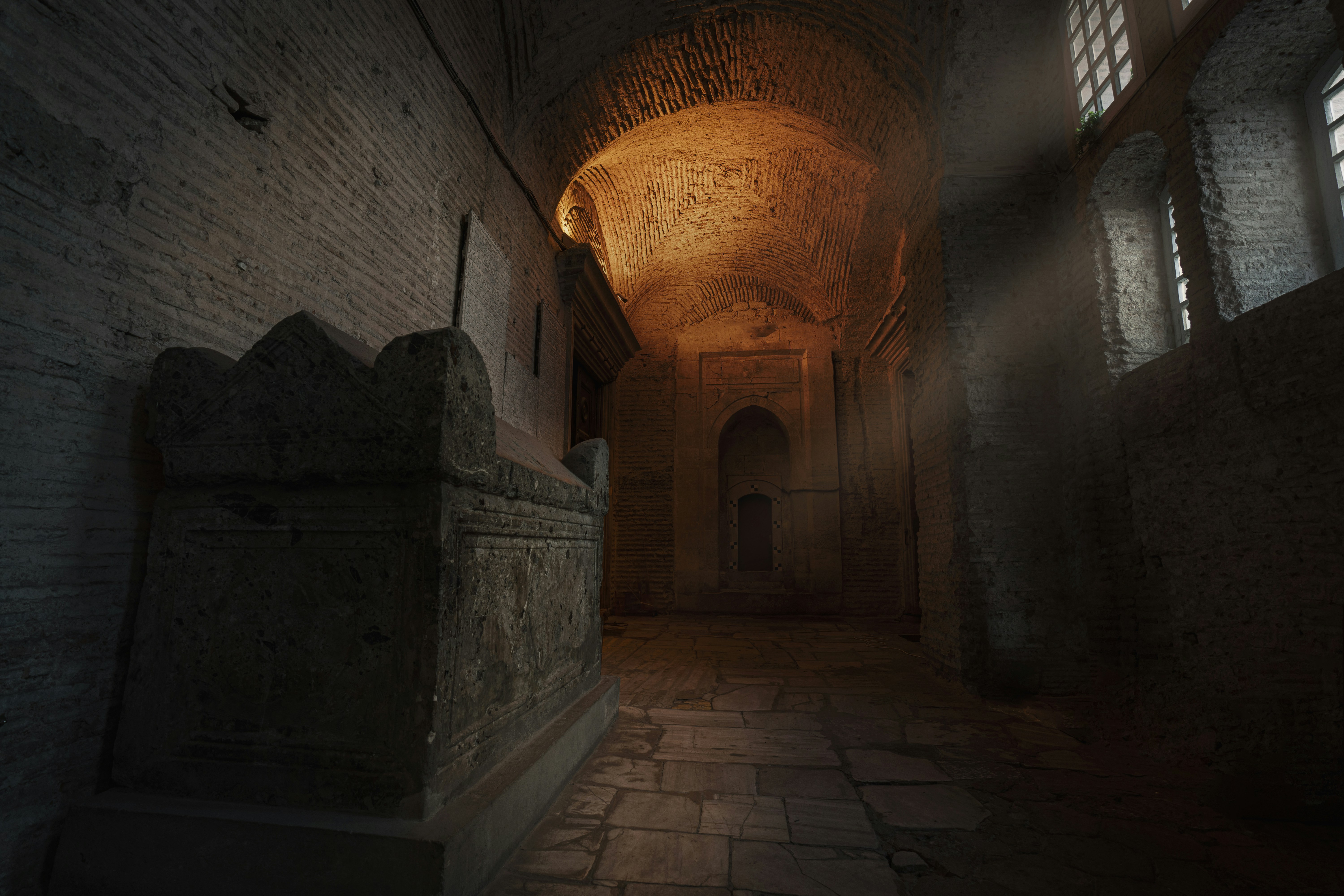 Echoes of the Vault: A Dimly Lit Corridor Beneath the Arch