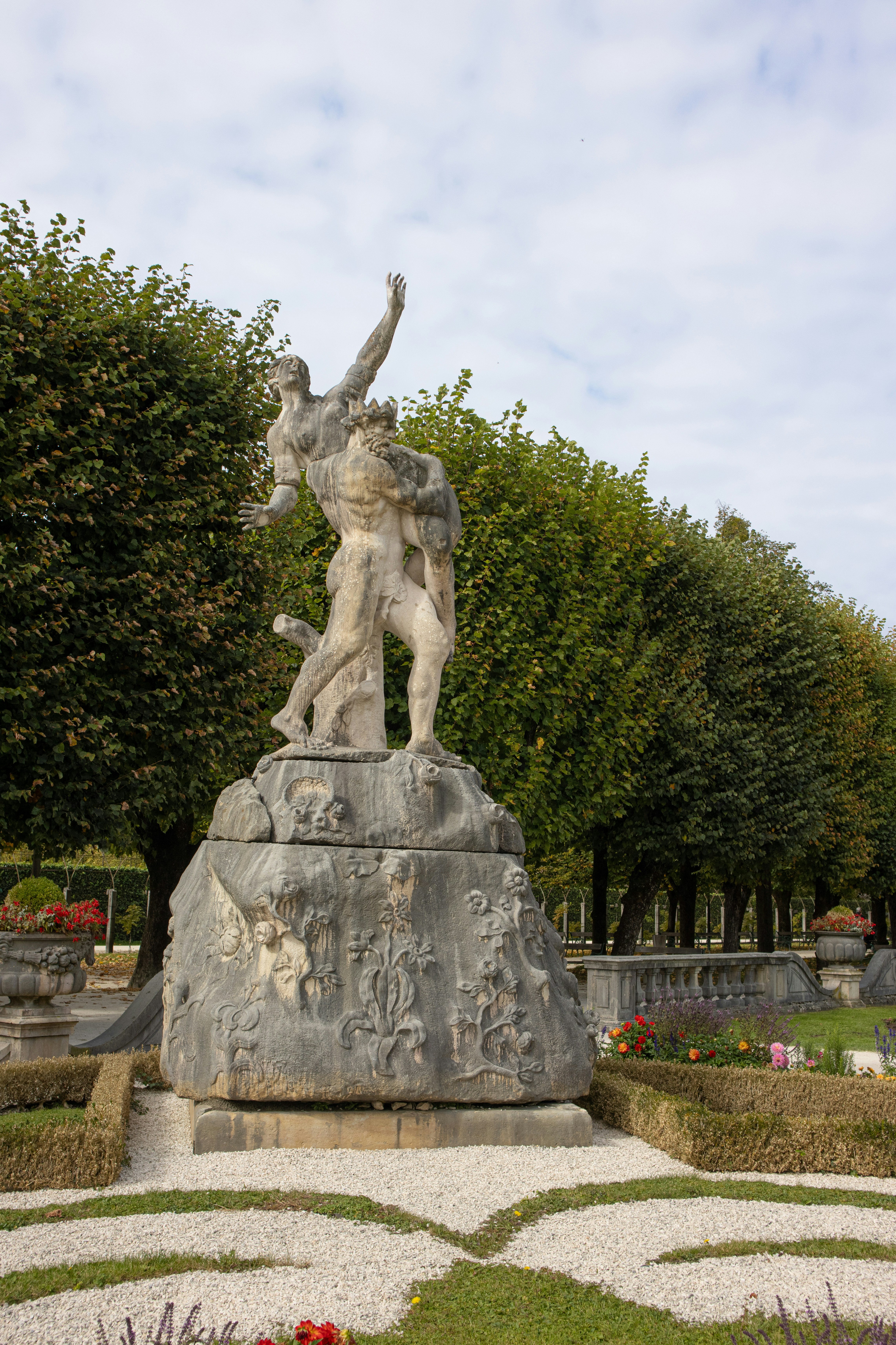 Statue Cresting the Marble Pedestal in a Garden of Neat Parterres
