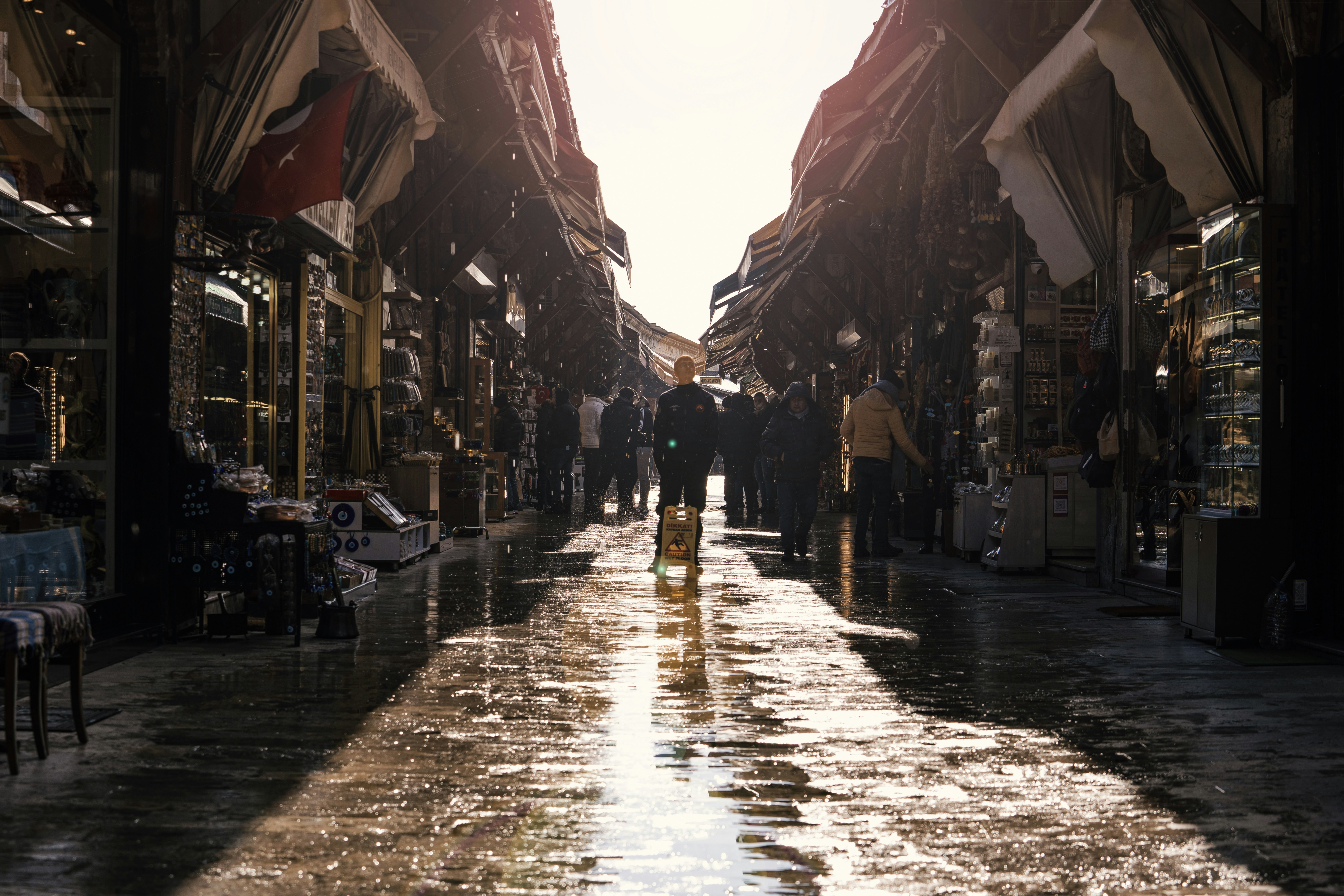 Sunlit Alleyway: A Lone Shopper Reclines the Glimmering Path