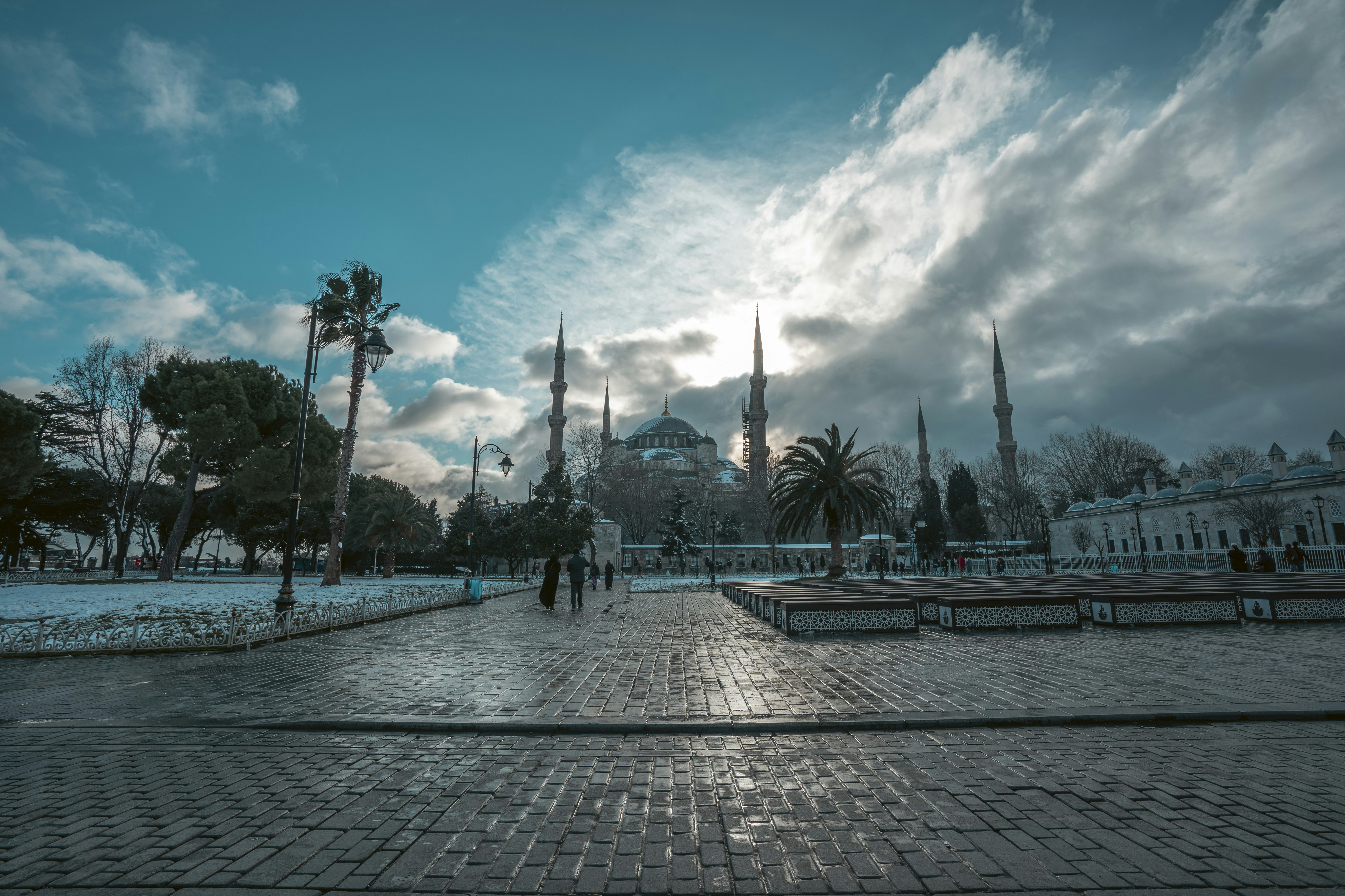 Minarets and Palm Shade: A Quiet Plaza at Dusk