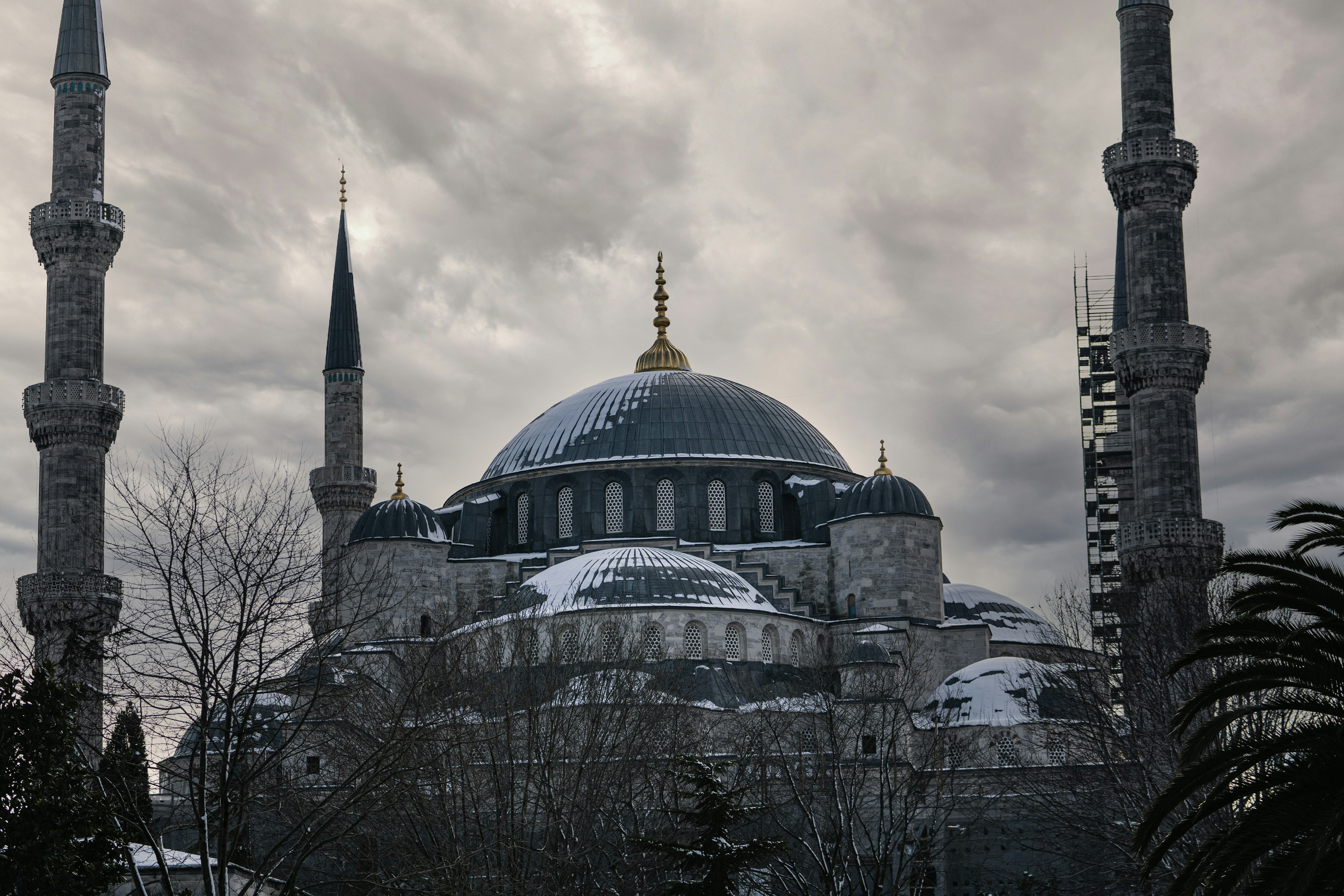 Snow-kissed Dome: A Serene Ottoman Mosque Under Brooding Skies