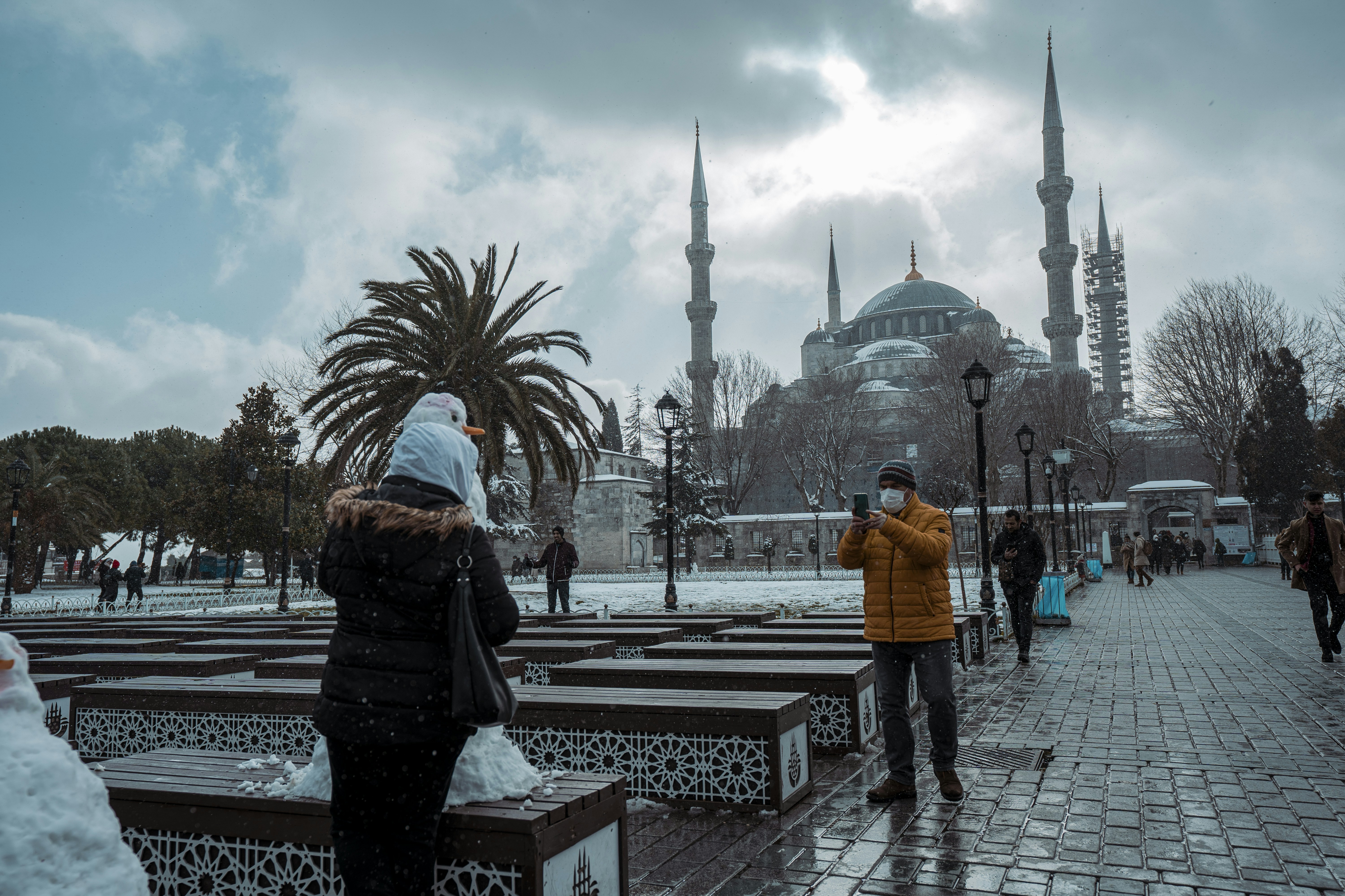 Snowy Istanbul Portrait: A candid moment before the Blue Mosque
