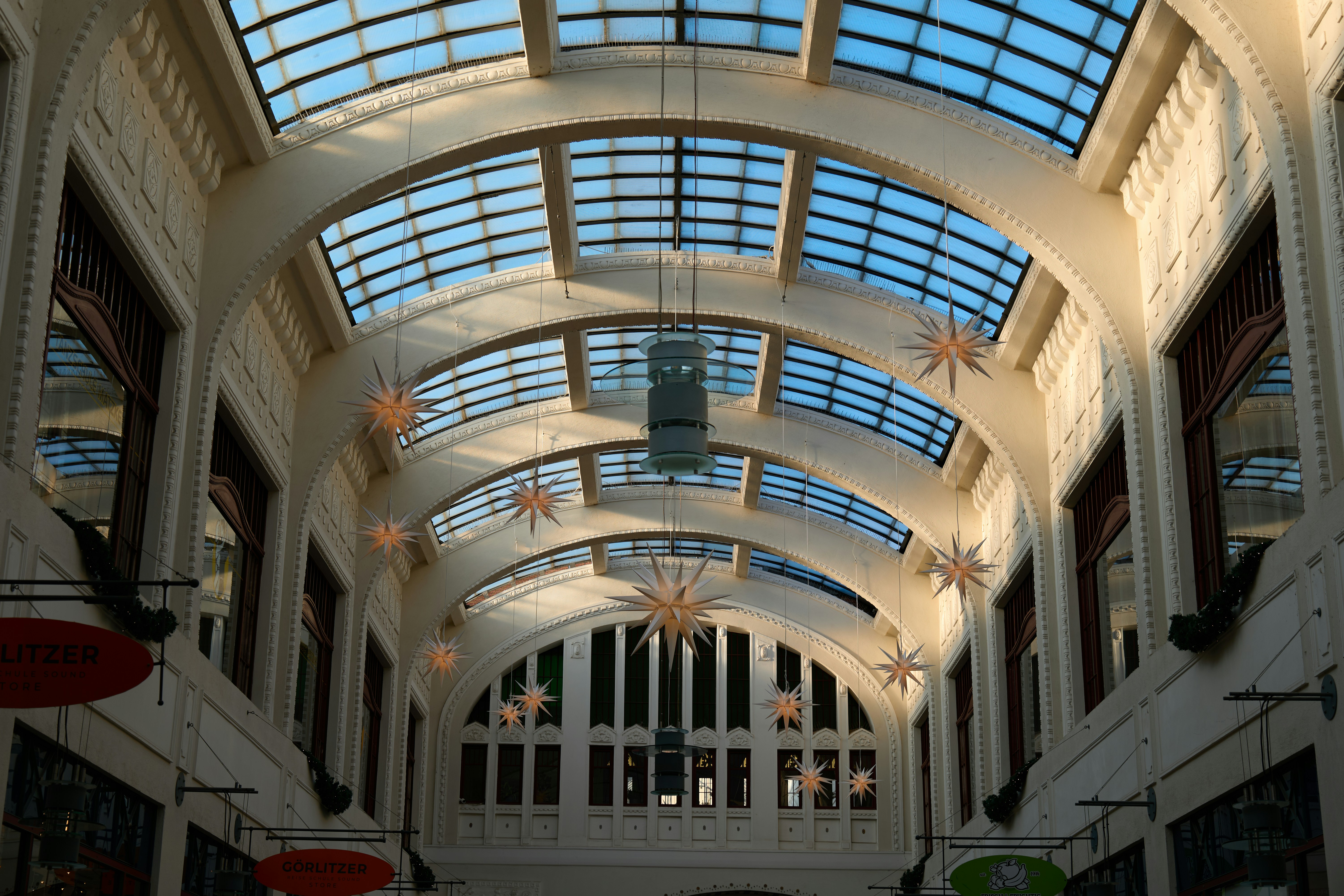 Archway of Light: A Sunlit Arcade With Starburst Ornaments