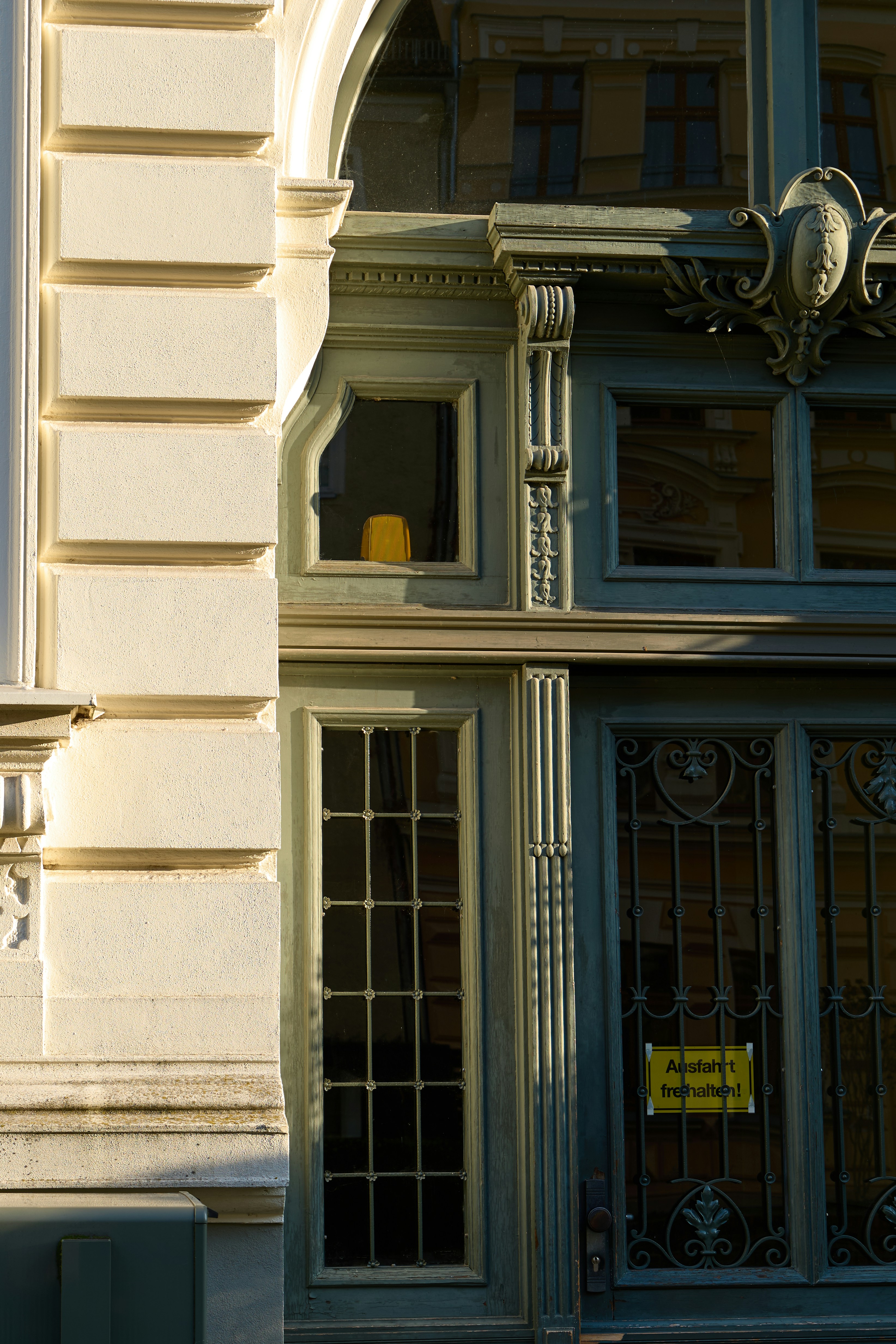 Sunlit Facade: A Glimpse into Ornate Windowwork
