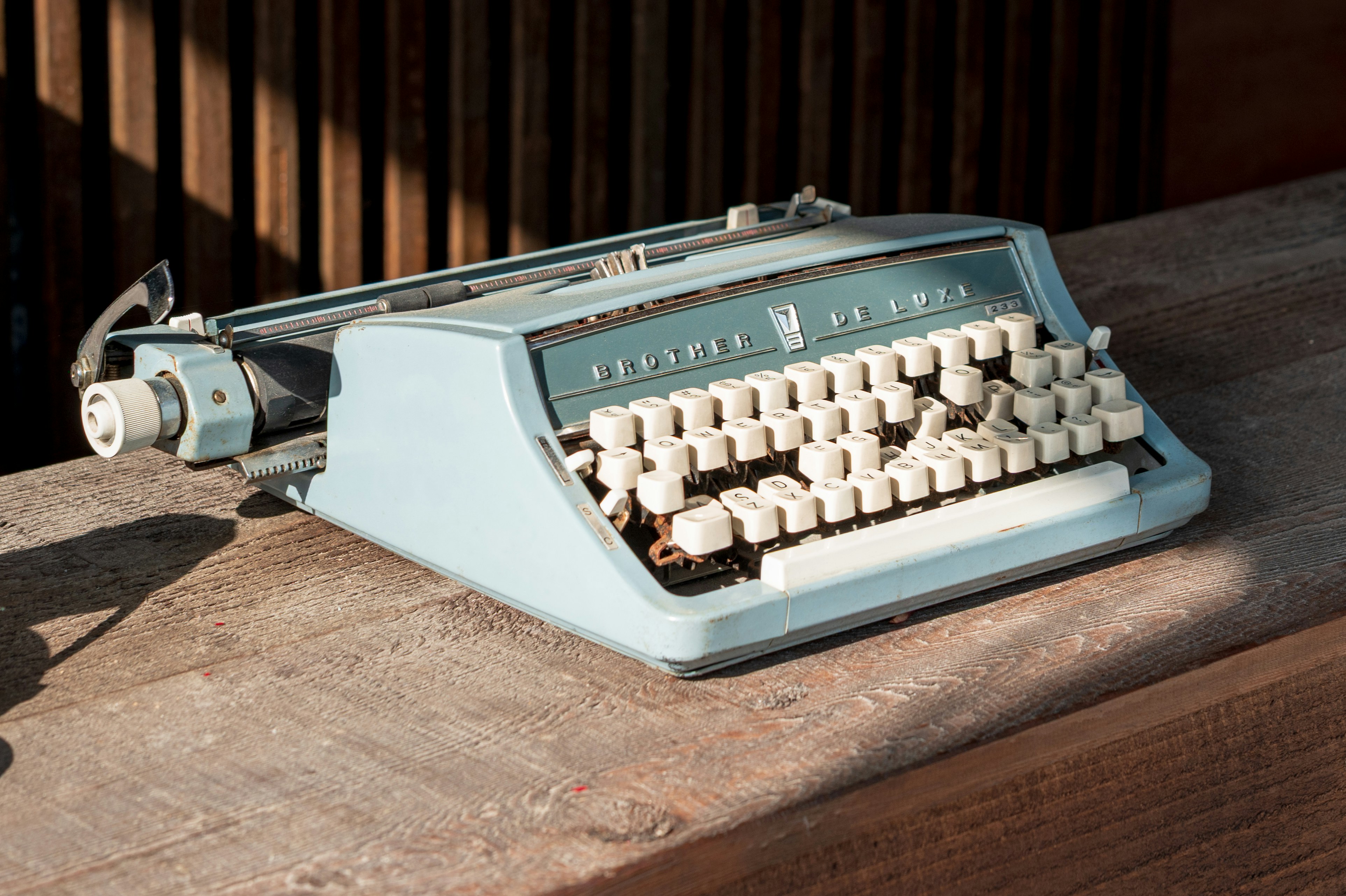 Pastel Steel Poet: A Vintage Typewriter in Quiet Light