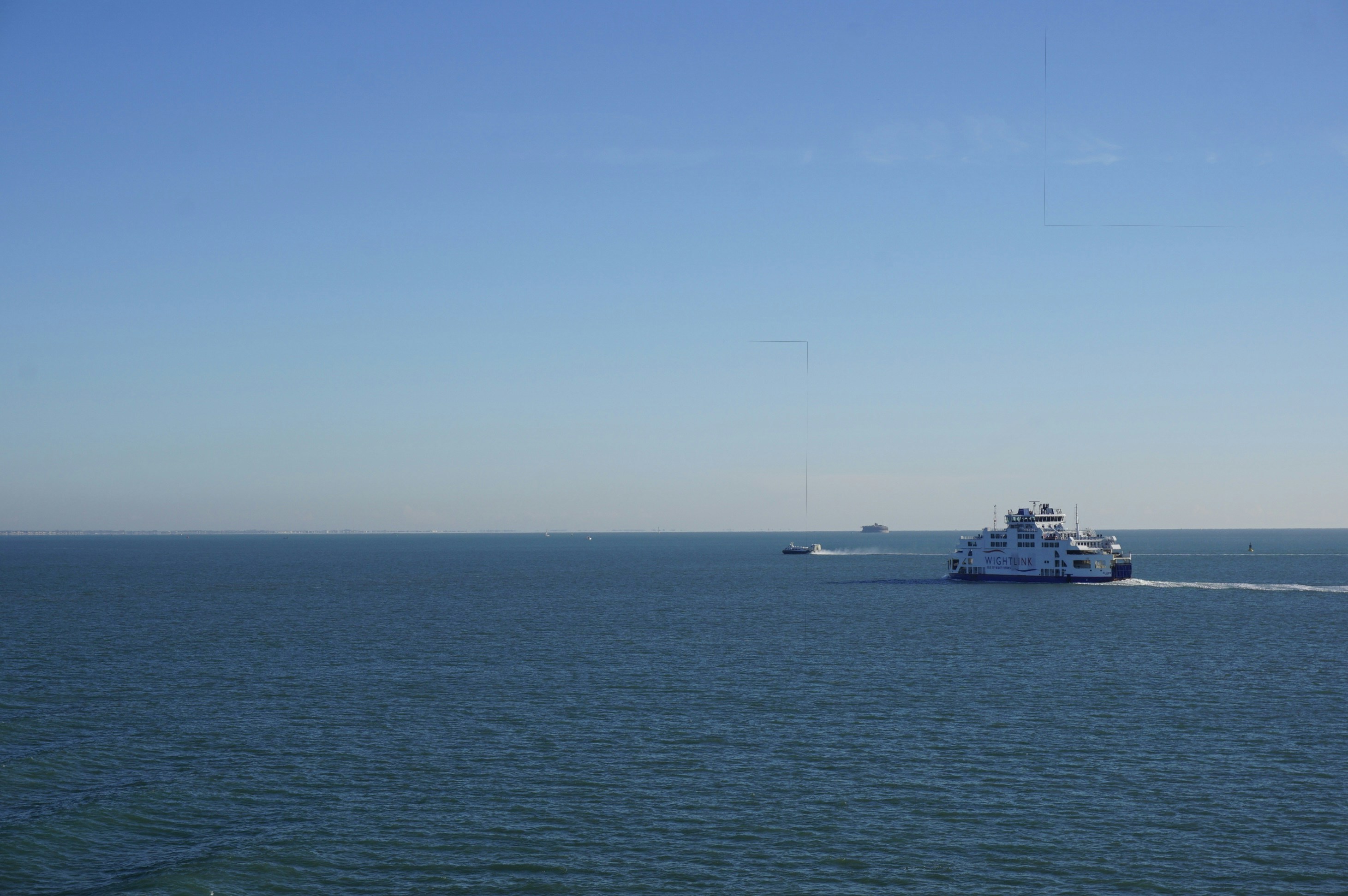Offshore Vessel Crossing: A Quiet Horizon with a White Ship