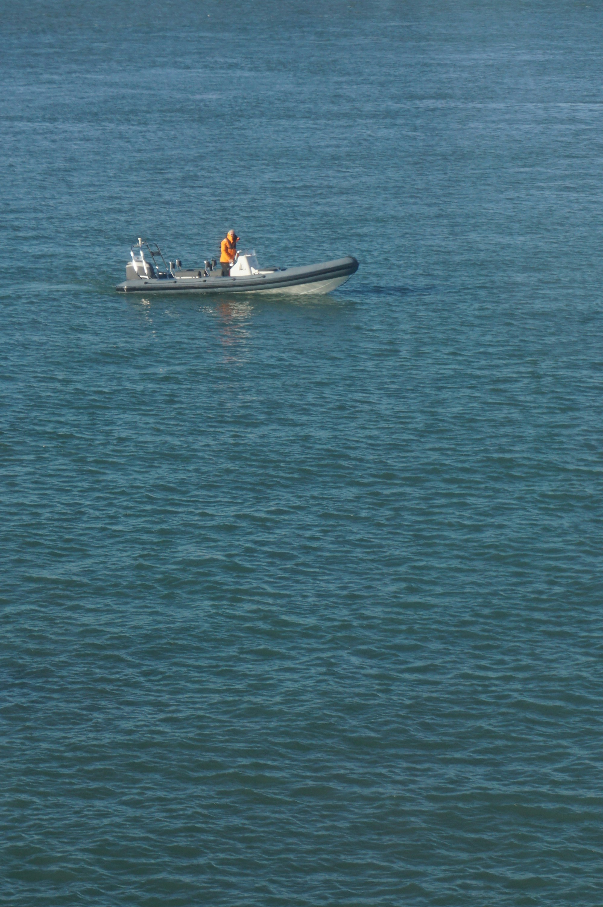 Isolated Boat Under Calm Blues