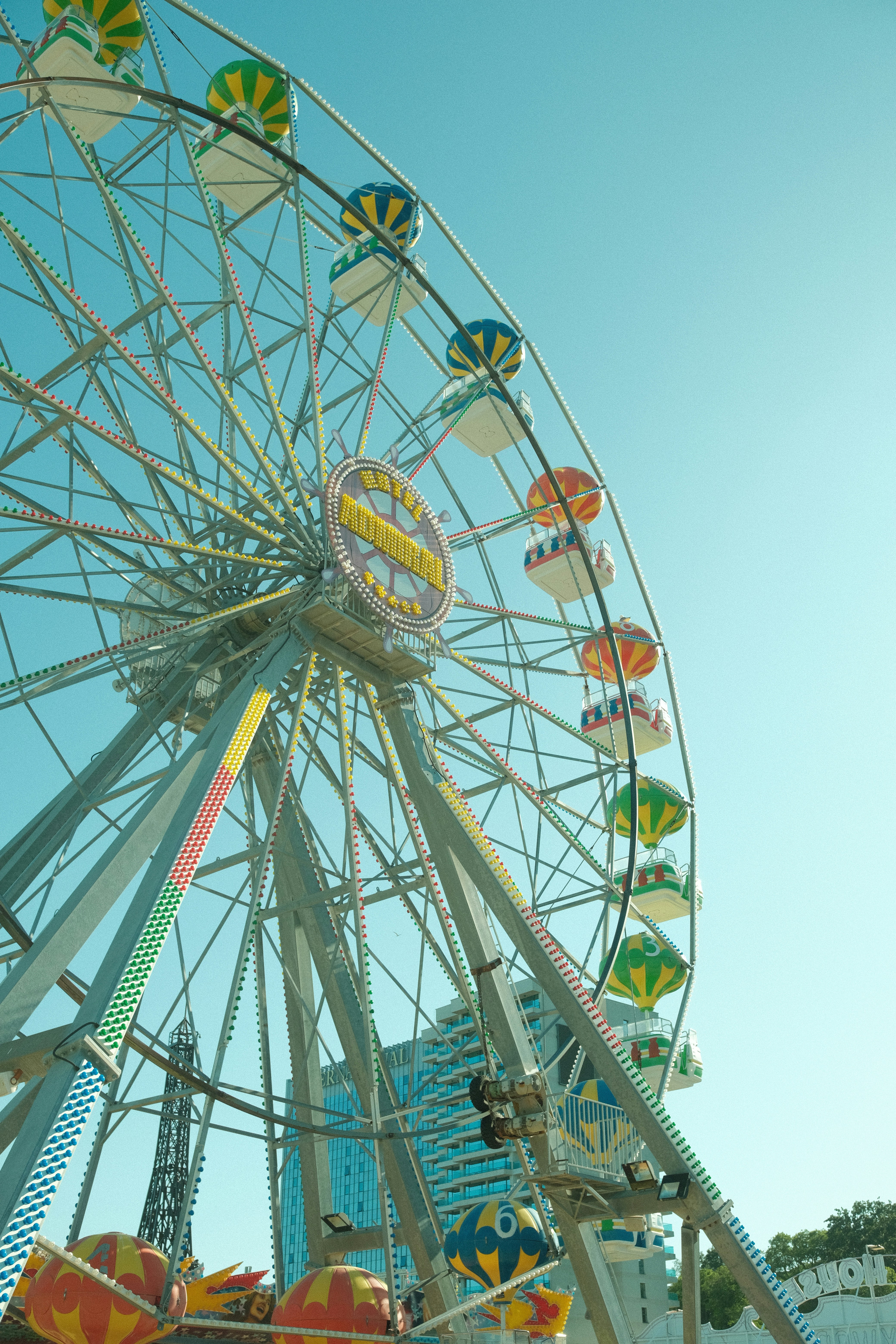 Ferris Wheel in Bright Lift: A Tilted Skyline Ride