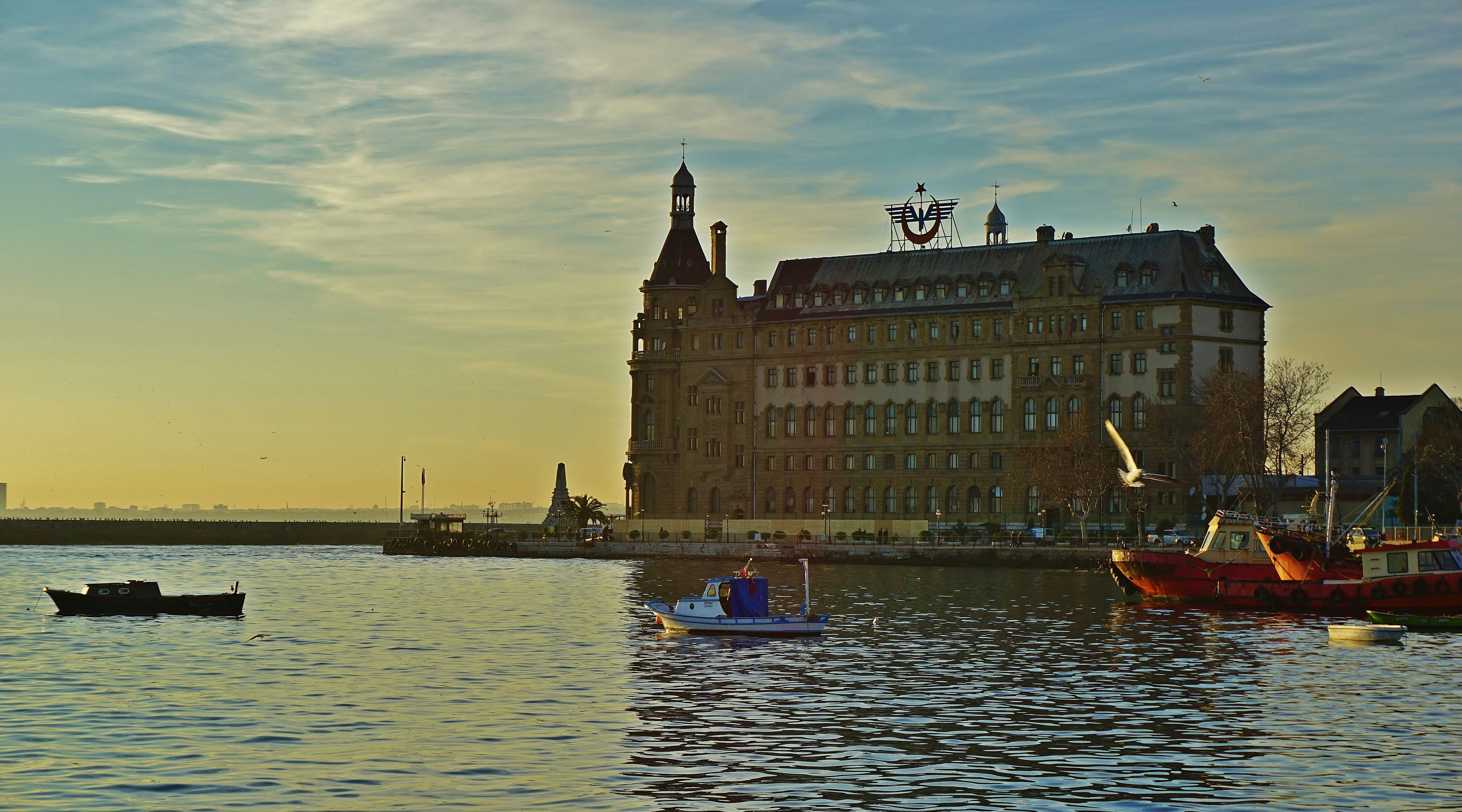 Harbor Vista: Historic Bastion Resting Along the Distant Docks at Sunset