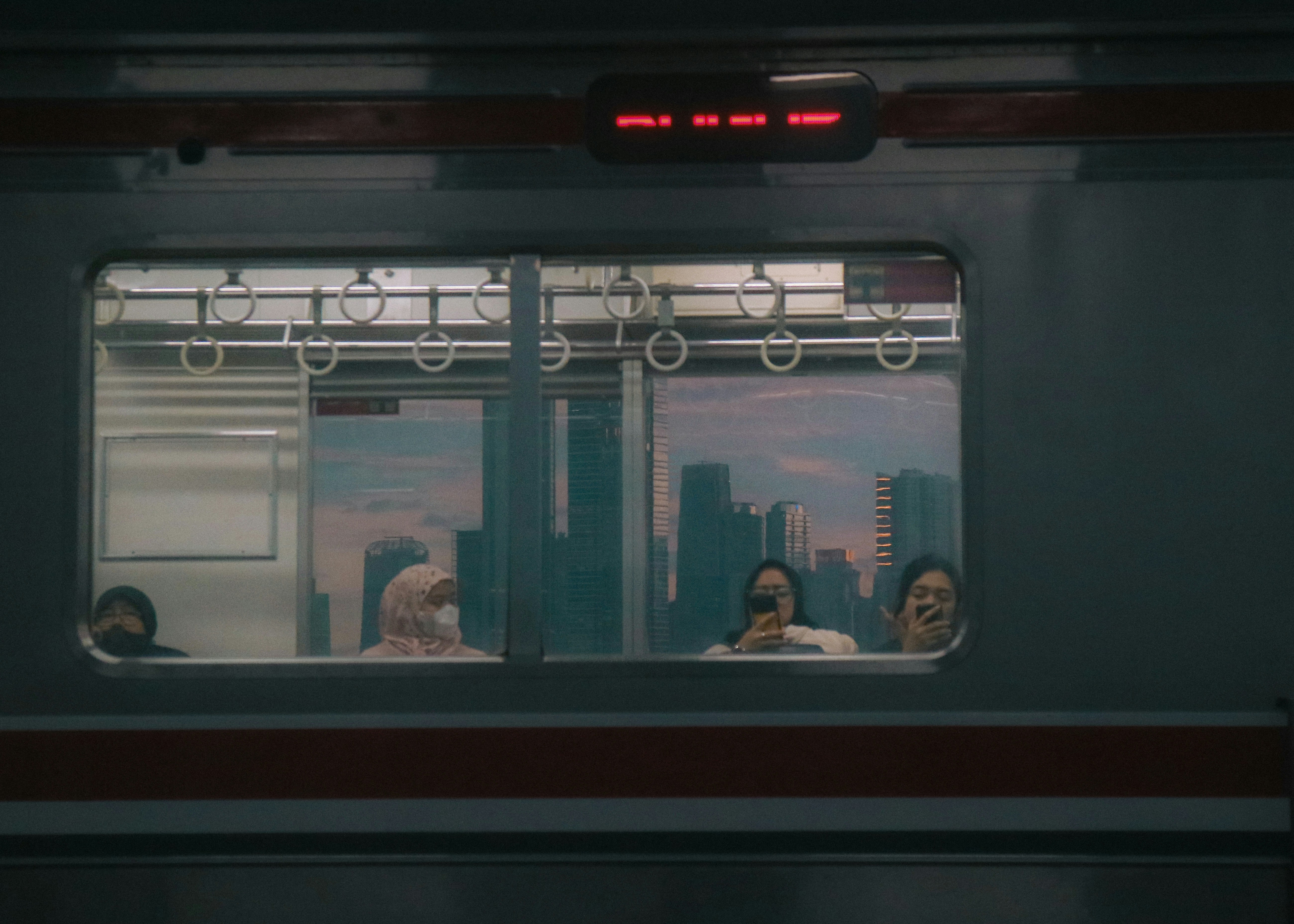 City Skyline Reflected in a Quiet Subway Window