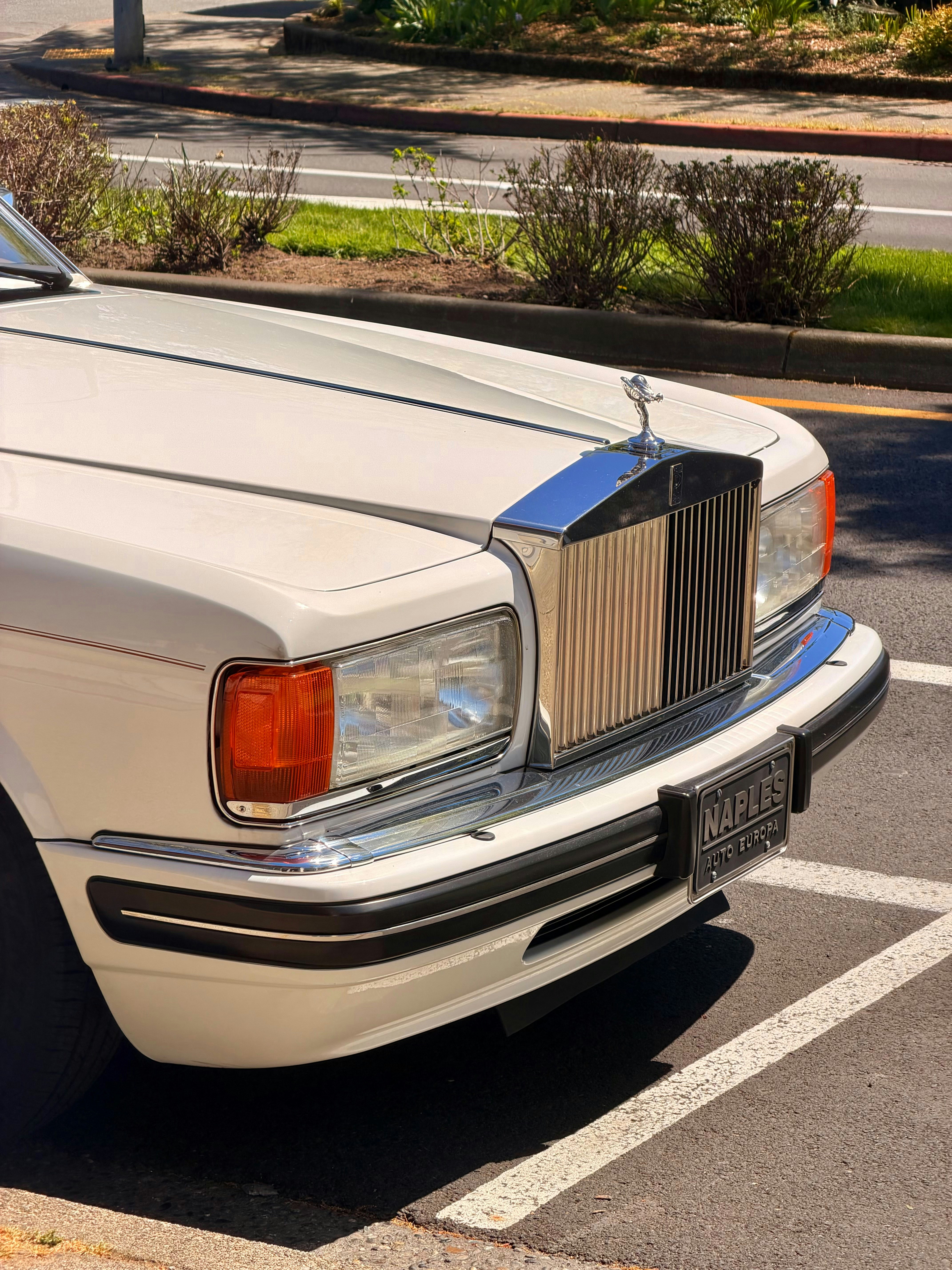 Chrome Grille Crown: A Classic Lincoln Front in Parking Lot Light