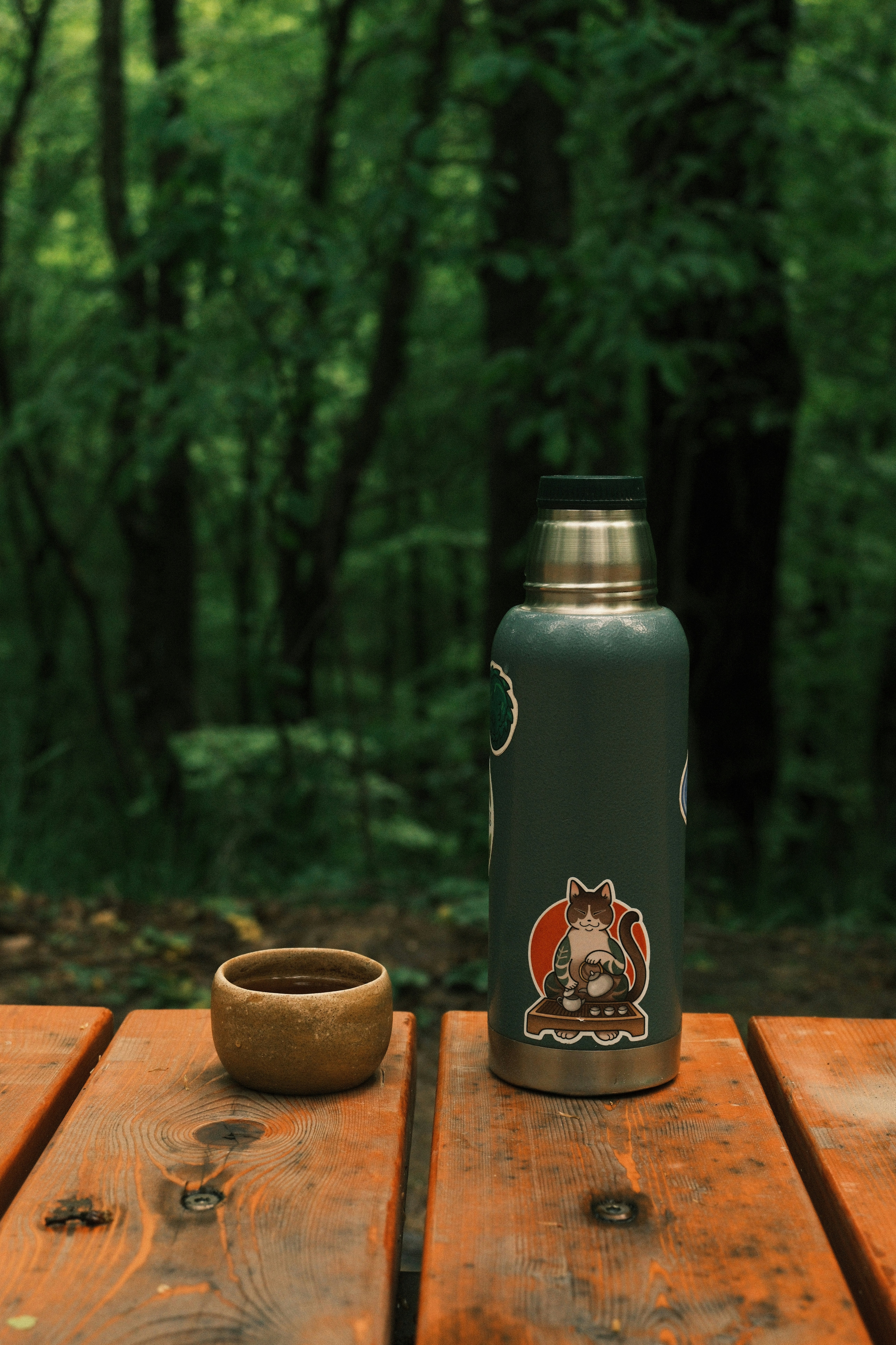 Forest Gathering: A Thermally Labeled Bottle on Weathered Wood