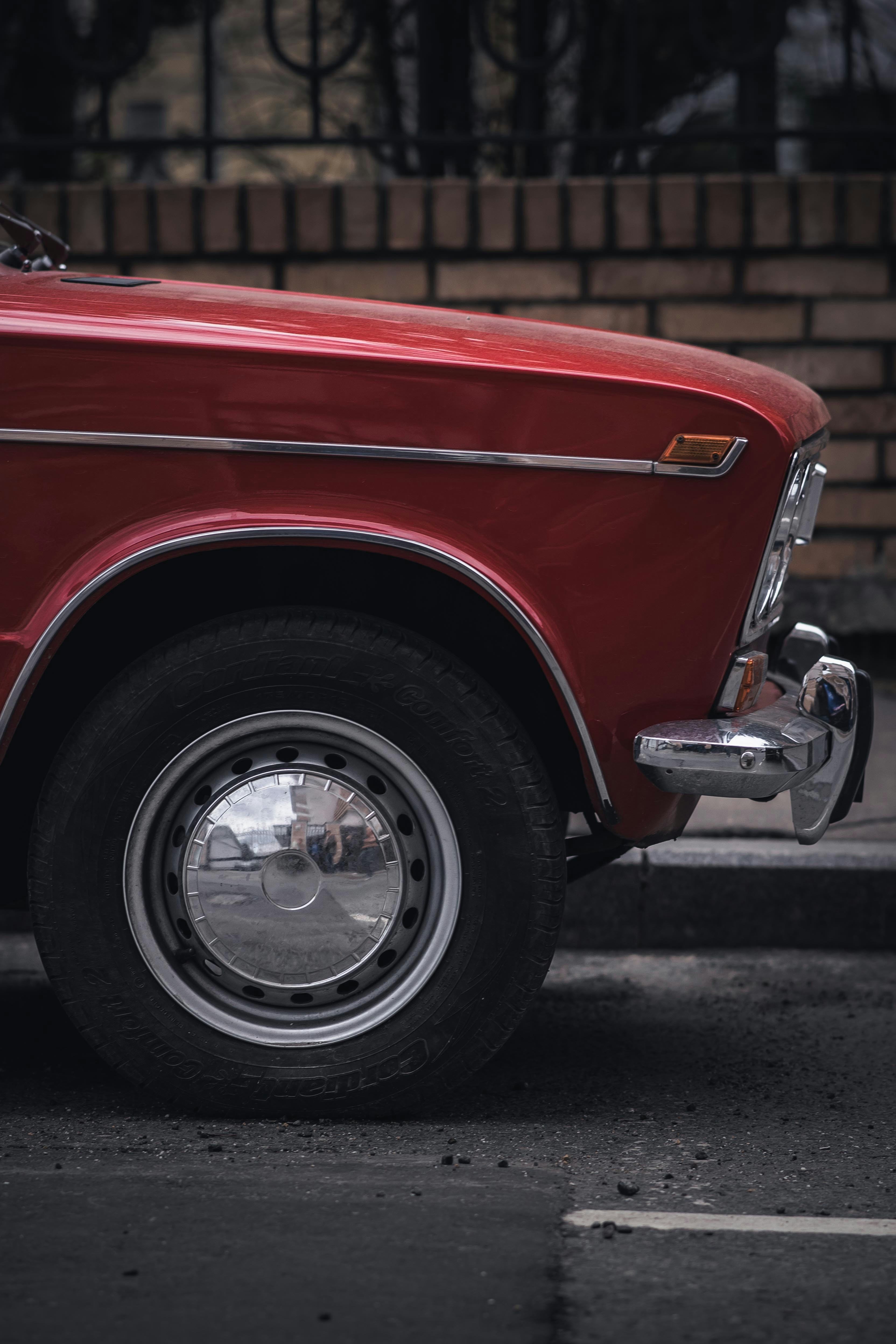 Crimson Classic: The Front Quarter of a Vintage Red Car