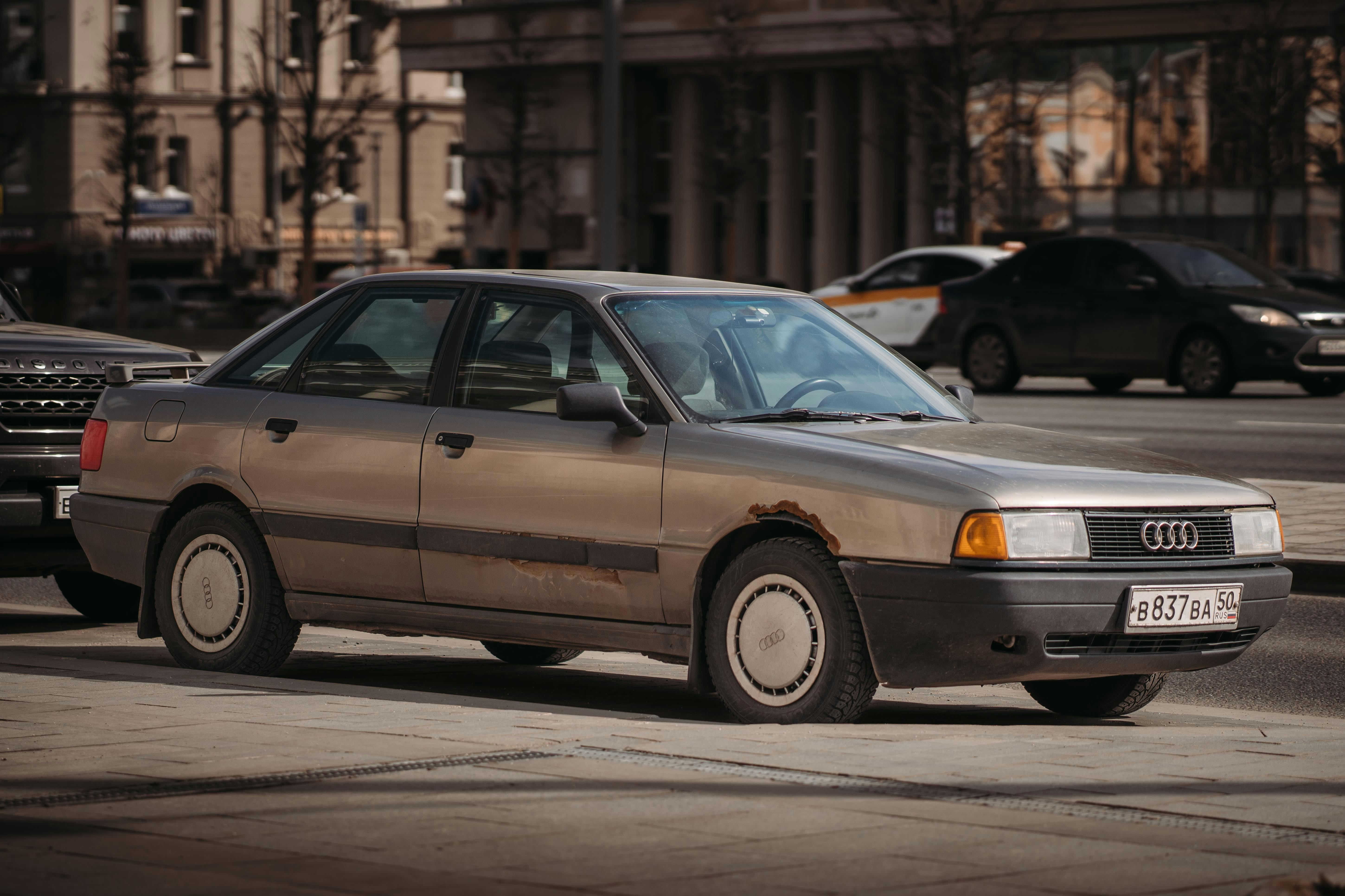 Dusty Audi on a City Street: A Quiet Moment of Retro Steel