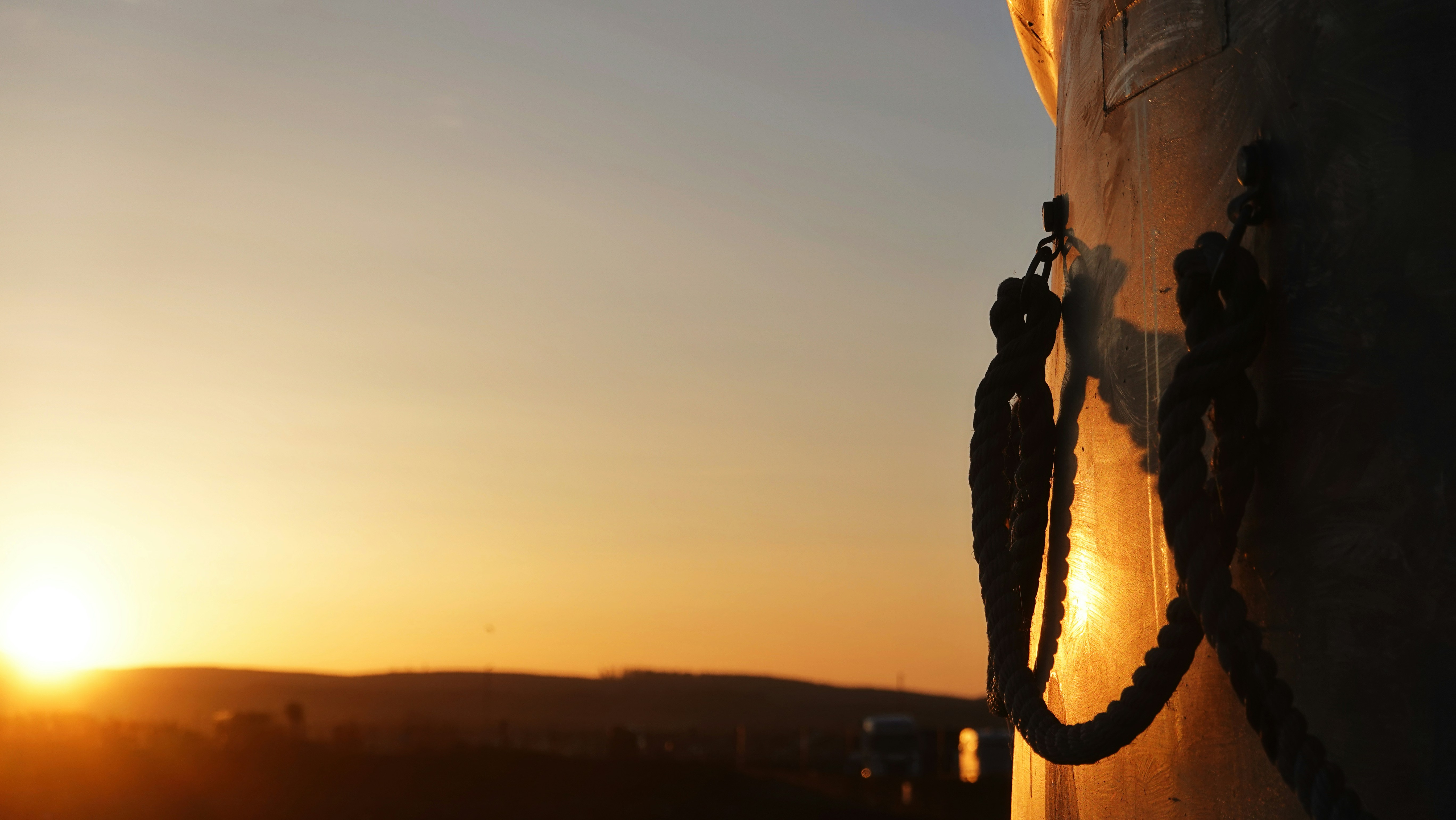 Rope Lights and Dusk: A Climber’s Silhouette at Sunset