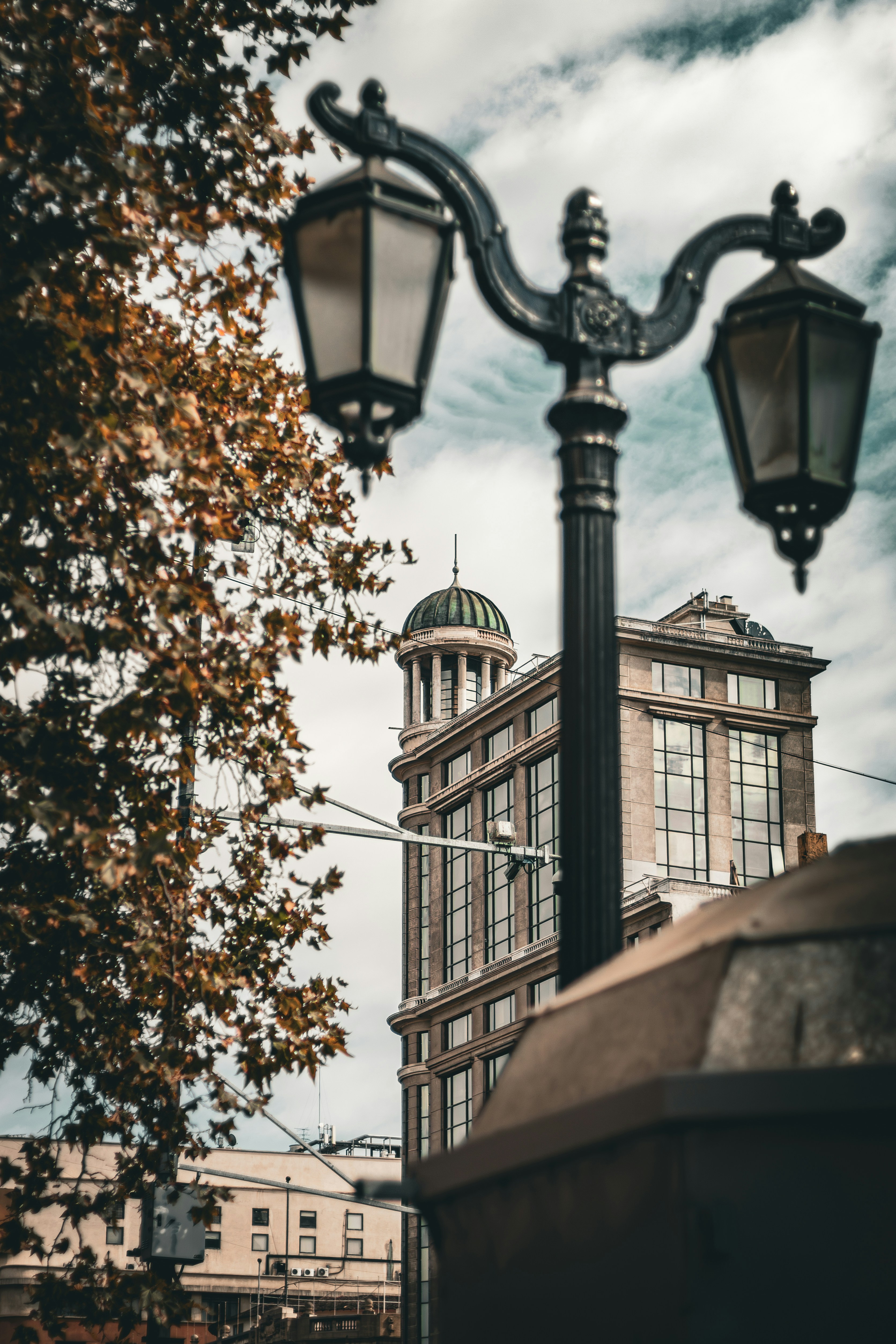 Urban Lanterns: A Street View Framed by a Classic Lamp Post