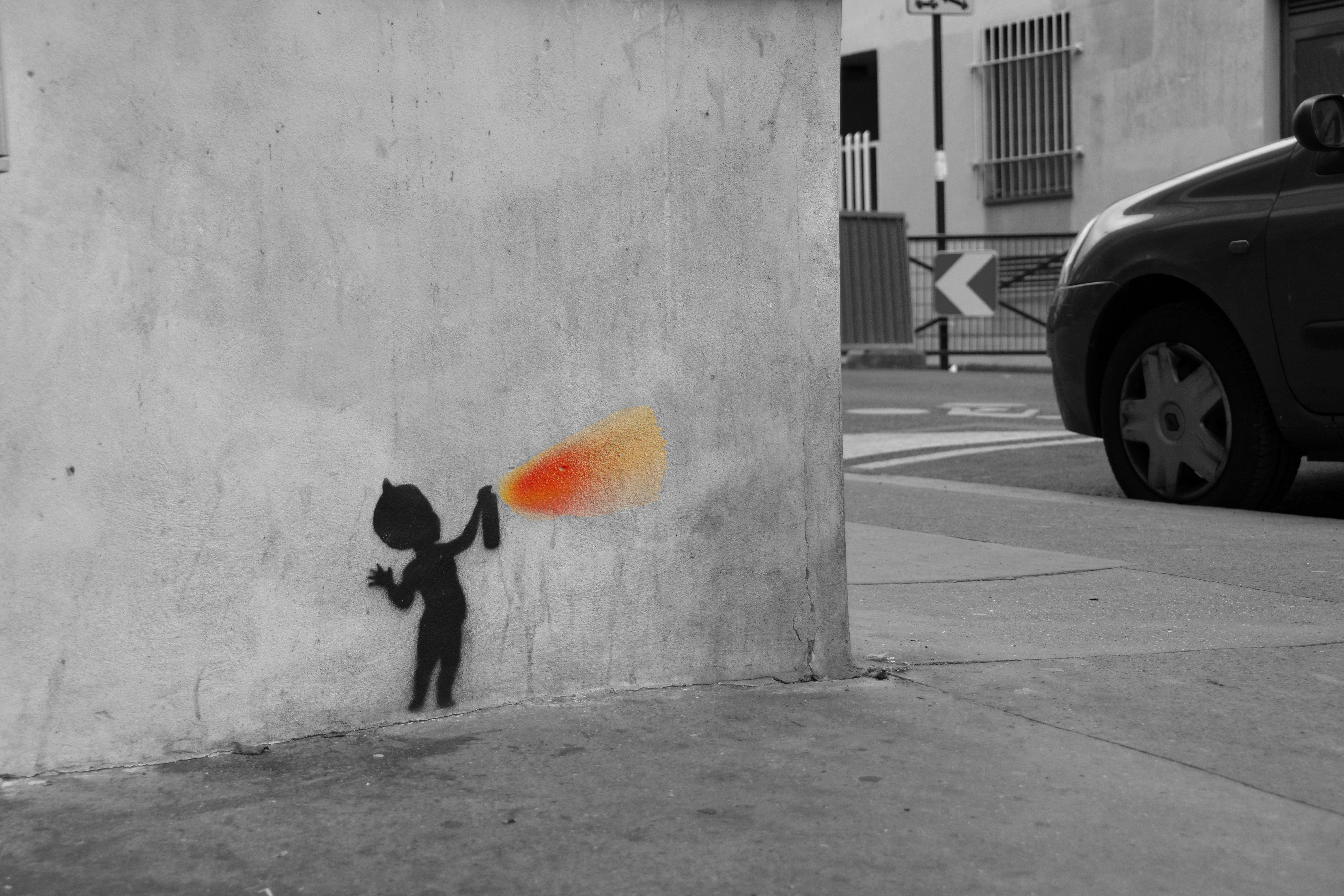 Spray-paint Fire: A Tiny Silhouette Emitting an Ember Cloud on an Urban Concrete Plane