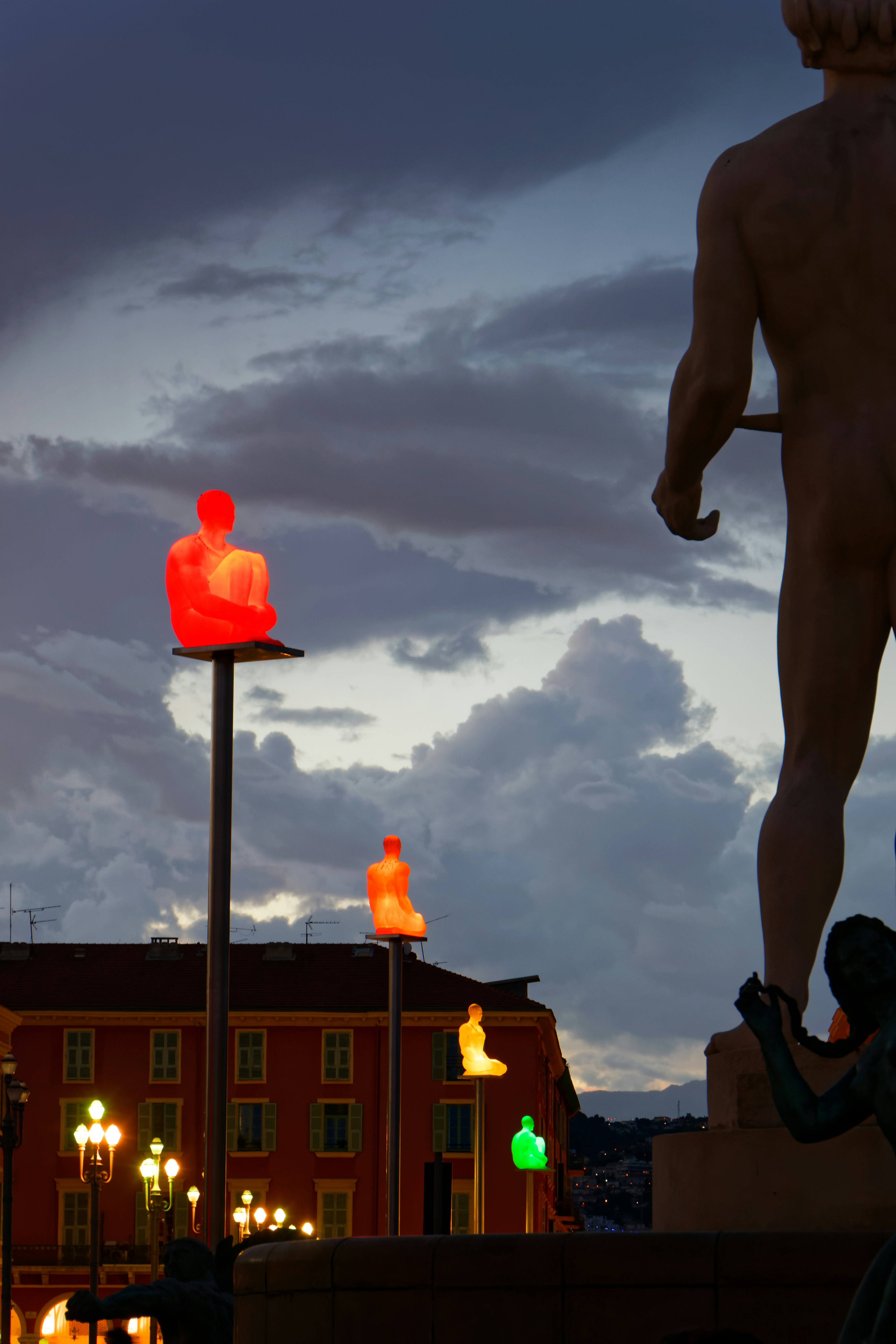 Neon Figures atop a City Evening