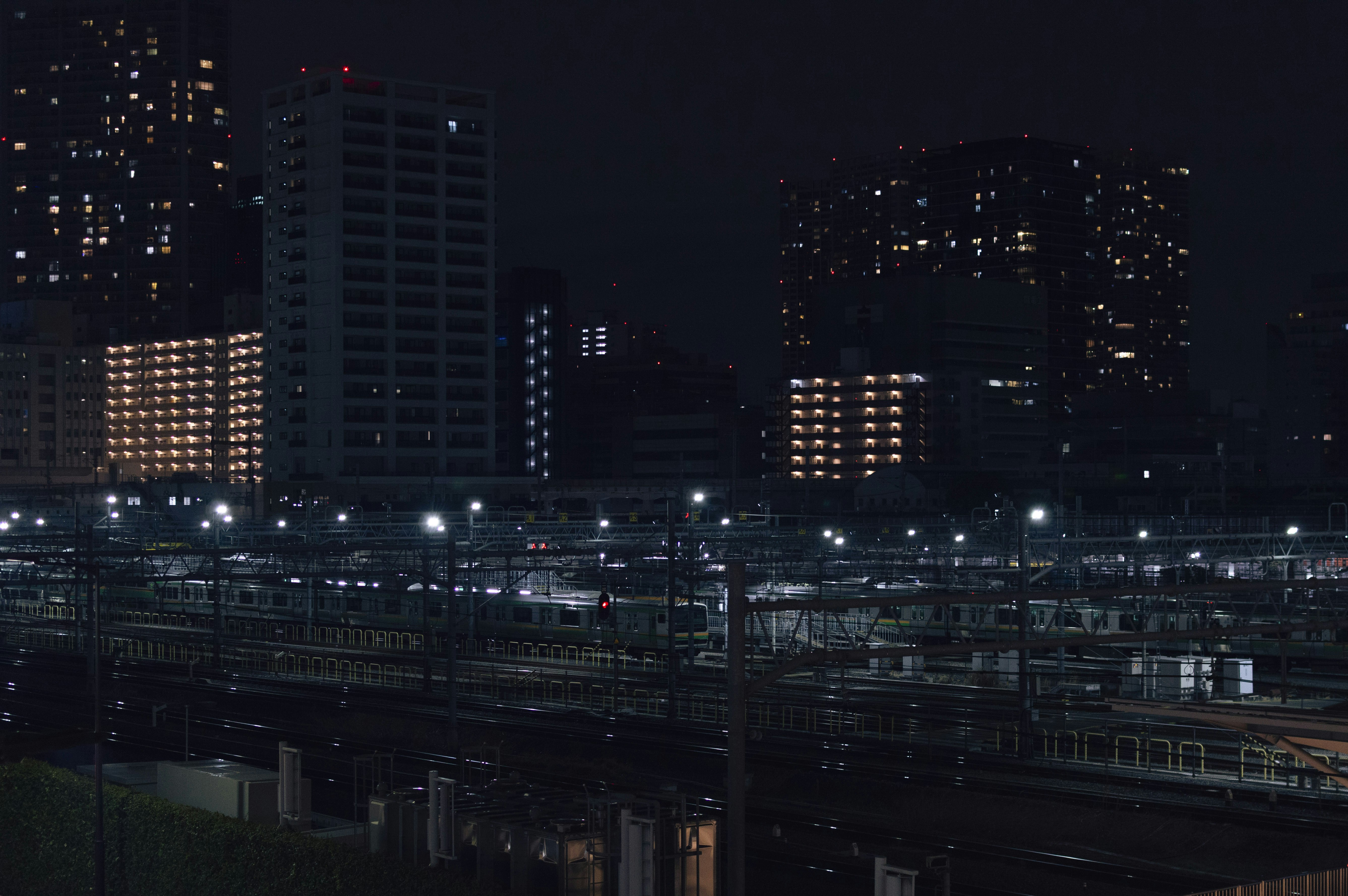 Night Railcape: City Lights Above the Tracks
