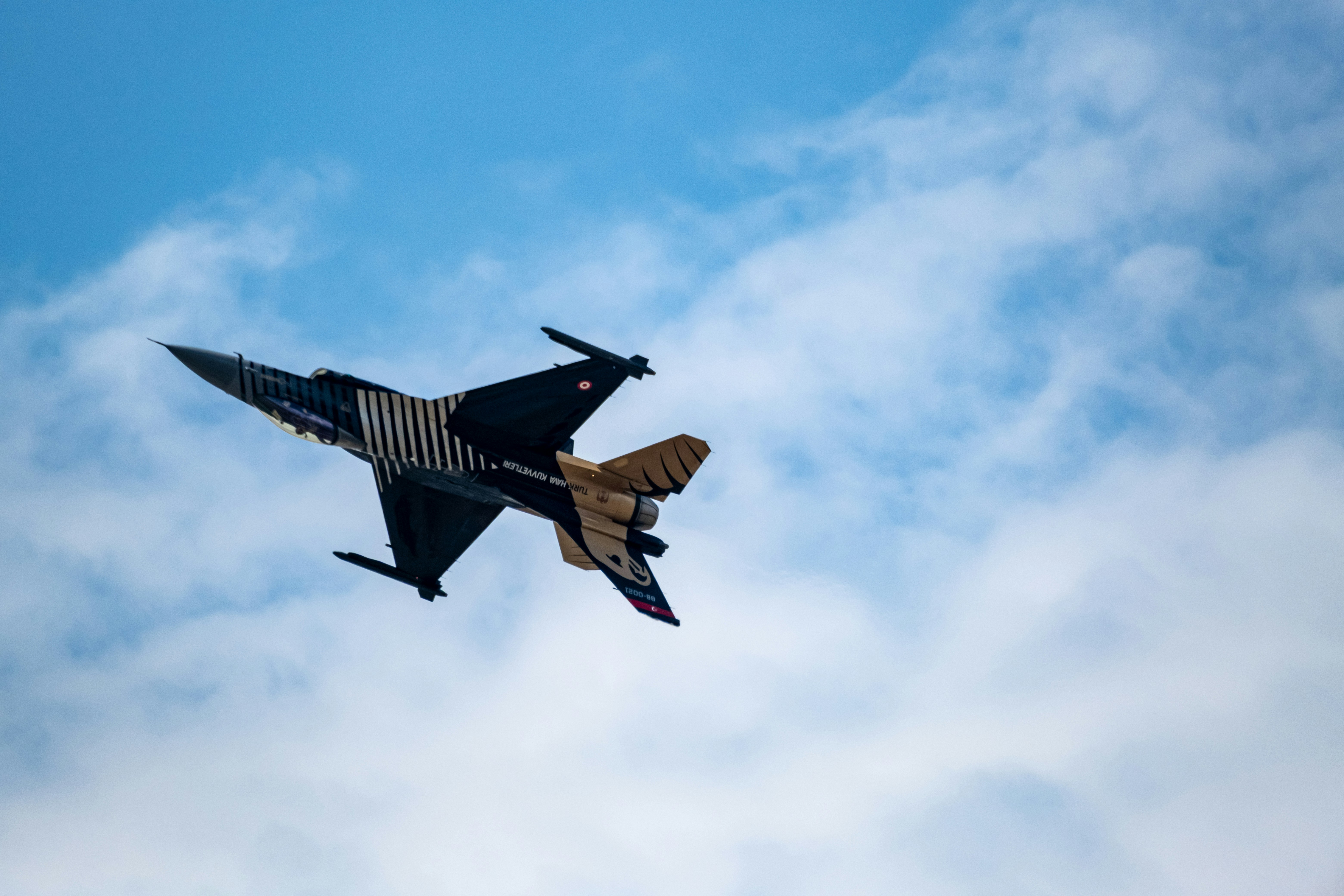 Arrowhead in the Sky: Striking Low-Altitude Jet Slicing Through Vivid Clouds