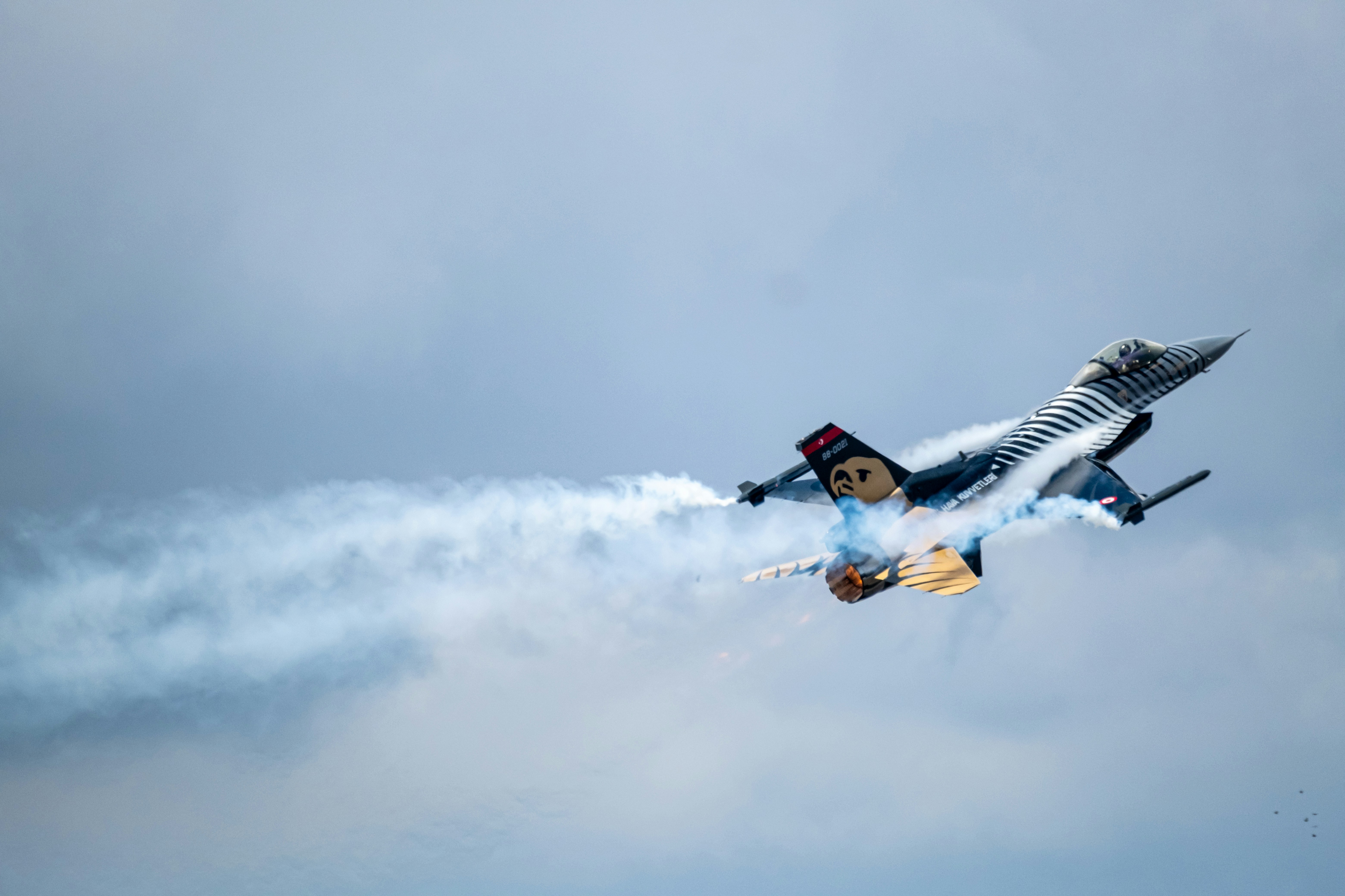 Aerobatic Duo in Blue Skies: Smoke Trails and Precision Flight