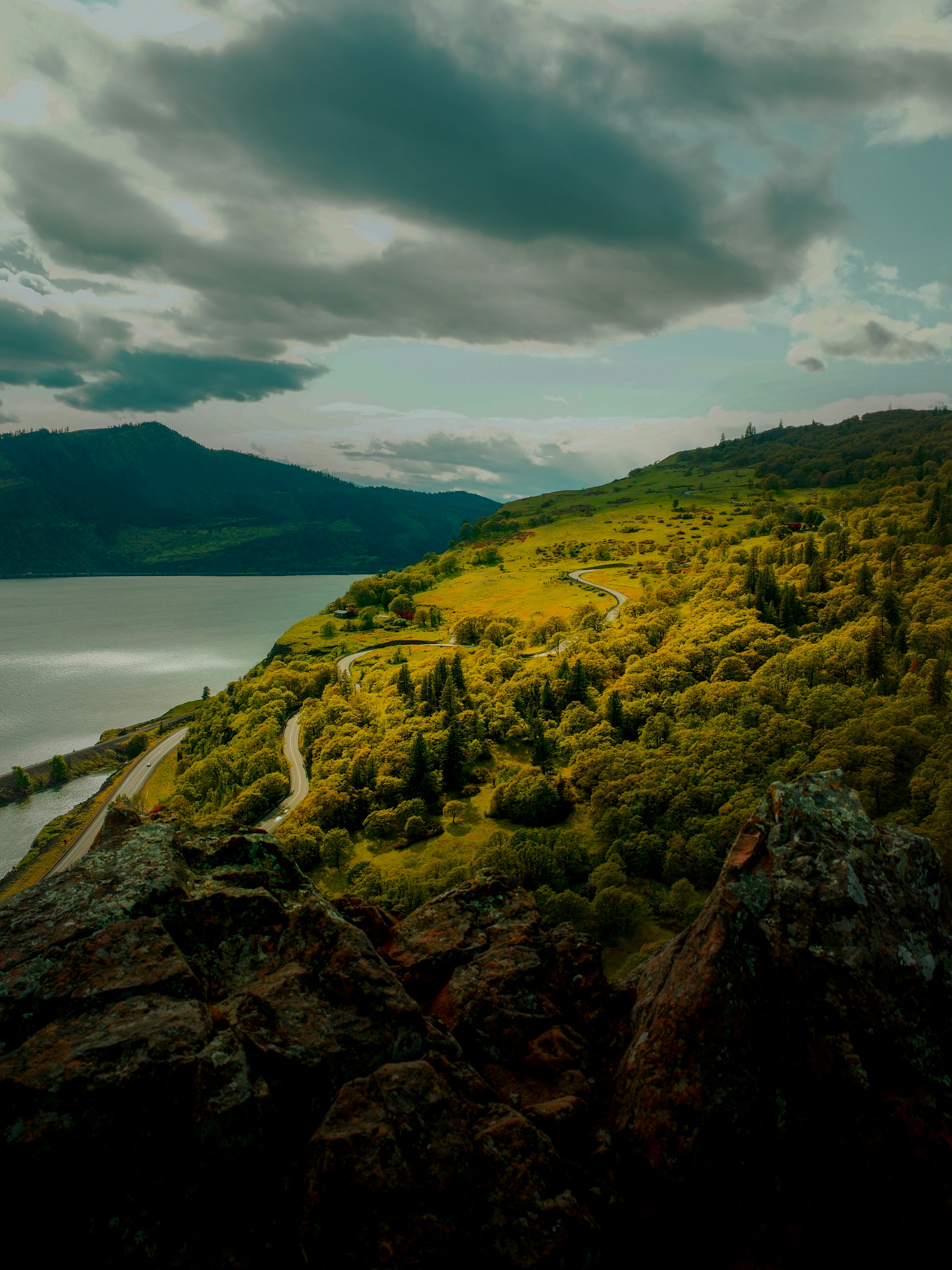Sunlit Ternary Ridge: A Winding Road Through Golden Hills Over Lake Serenity