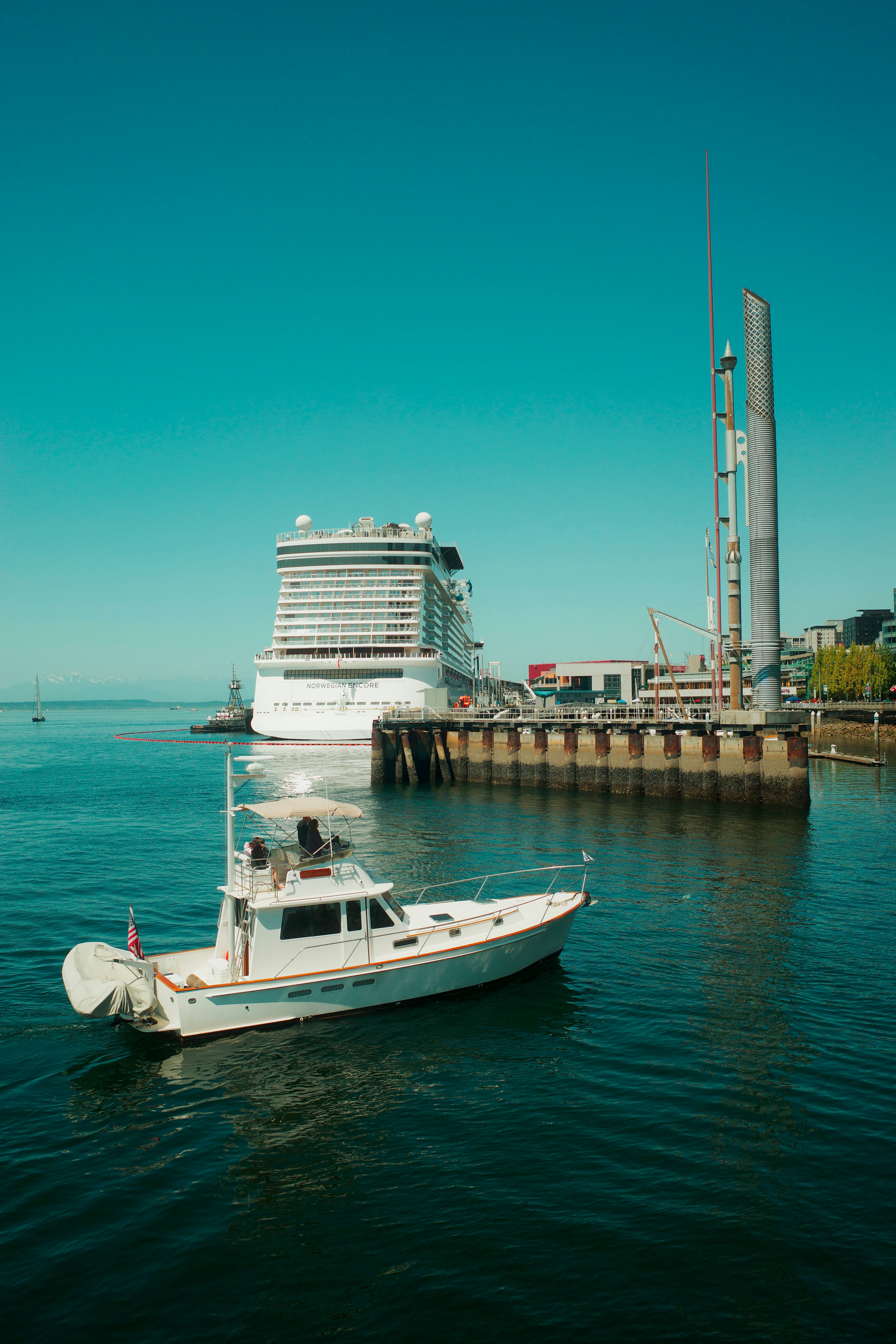 Toward the Ocean Pier: A Marina with a Cruise Ship and Tender Boat