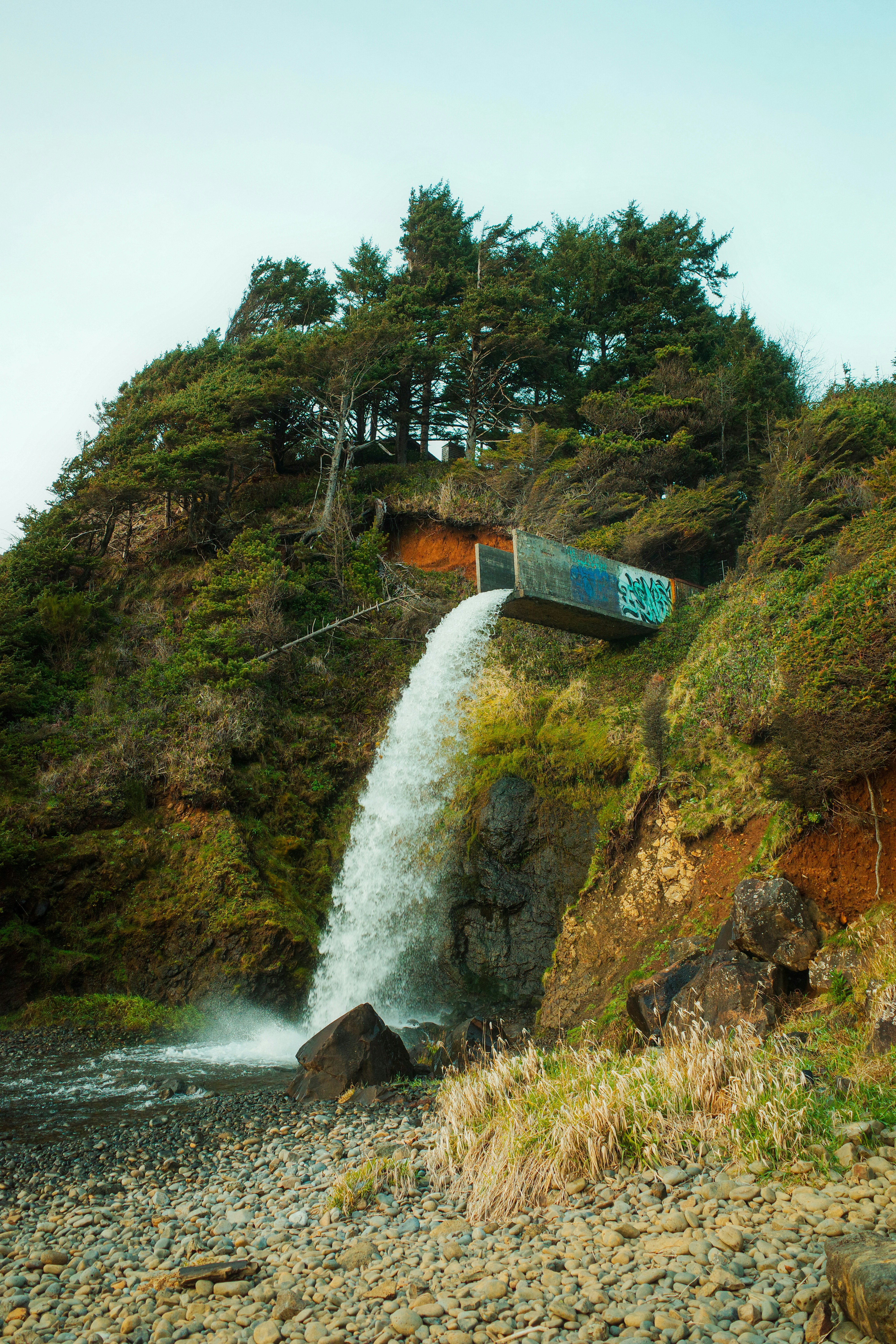 Waterfall Bridge: A Hidden Cascade Over Carved Cliffs