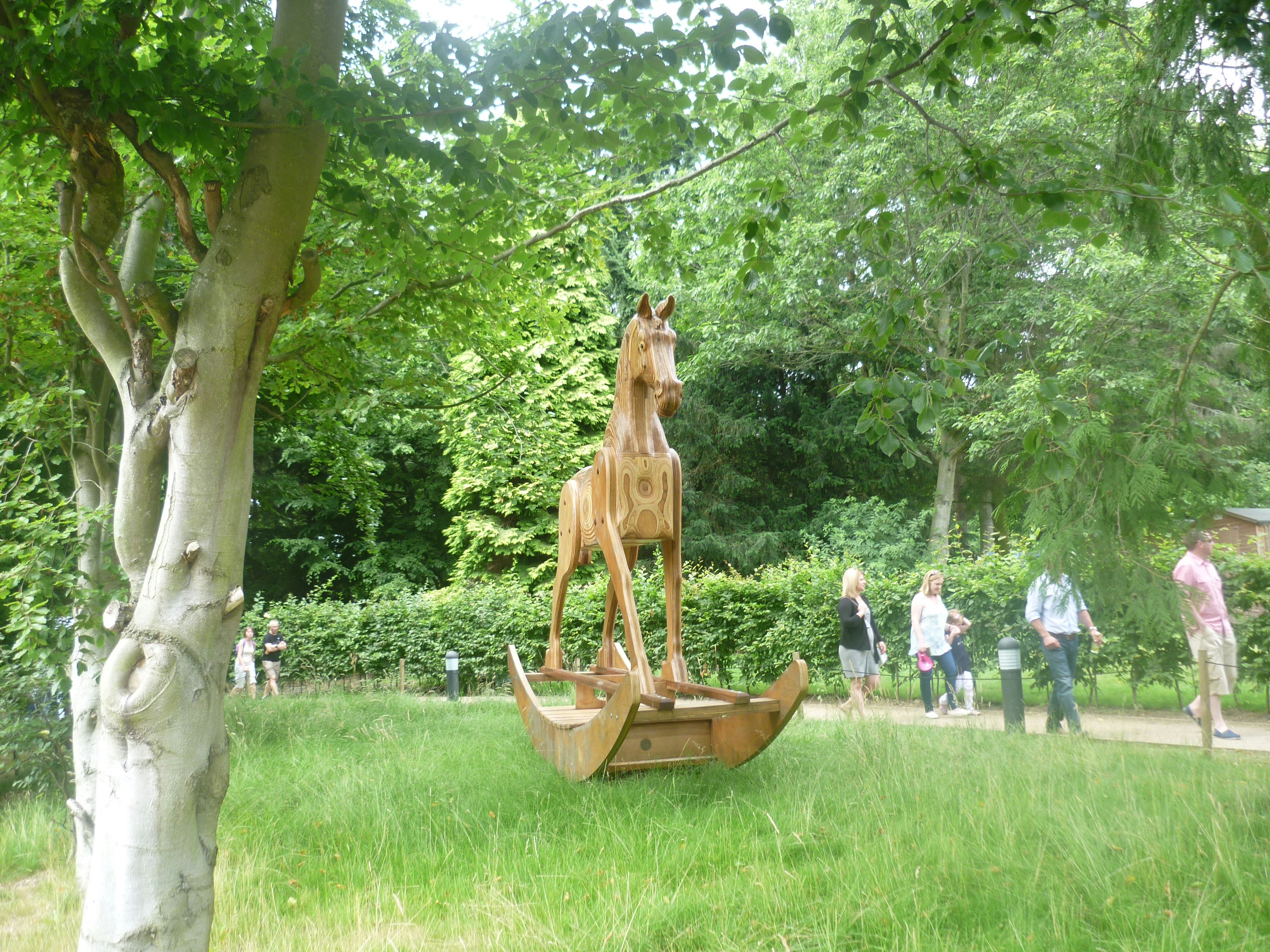 Wooden Horse in the Park: A Quiet Moment amid Greenery