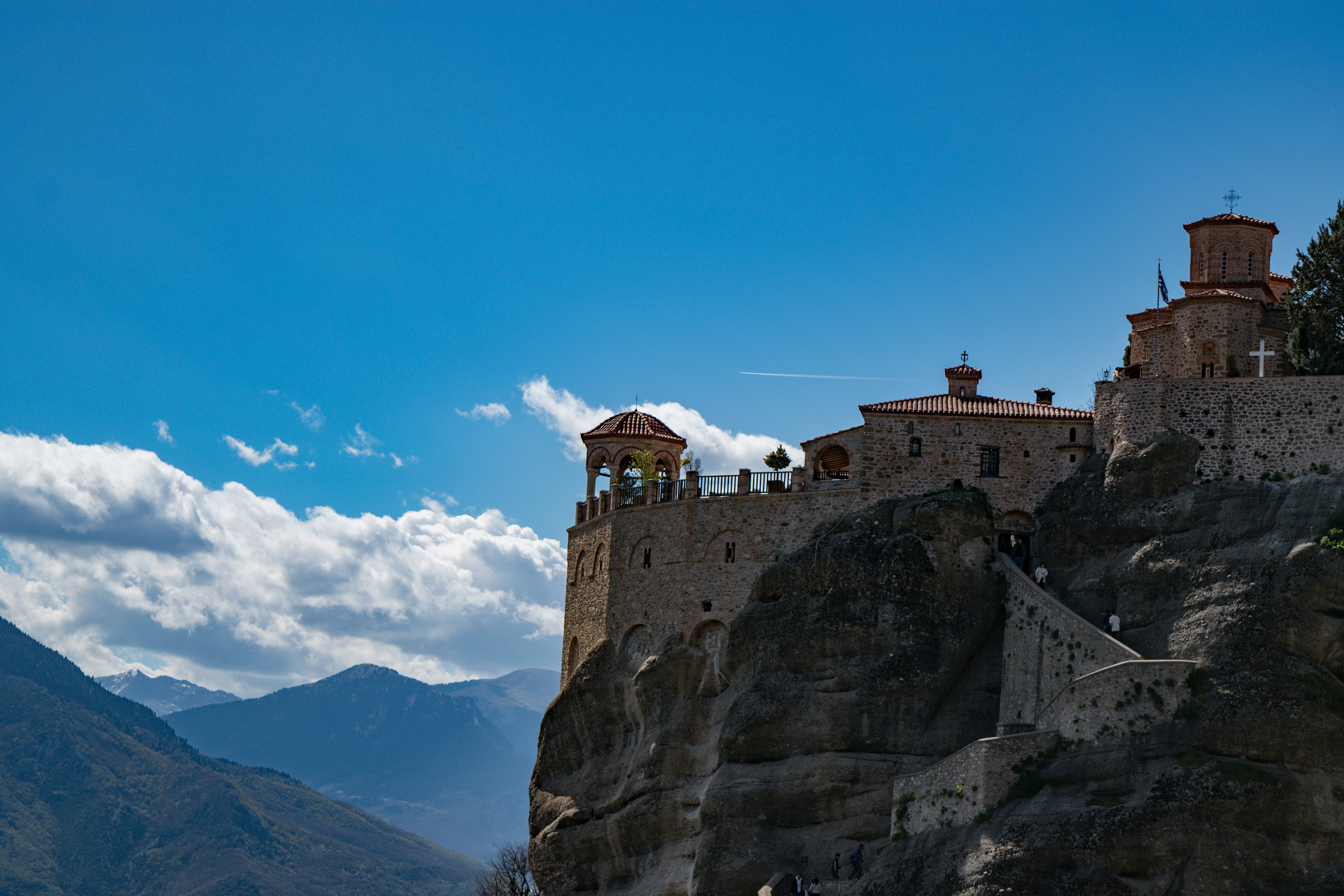 Castle on the Cliff: A Monolithic Fortress Crowned by Clear Skies
