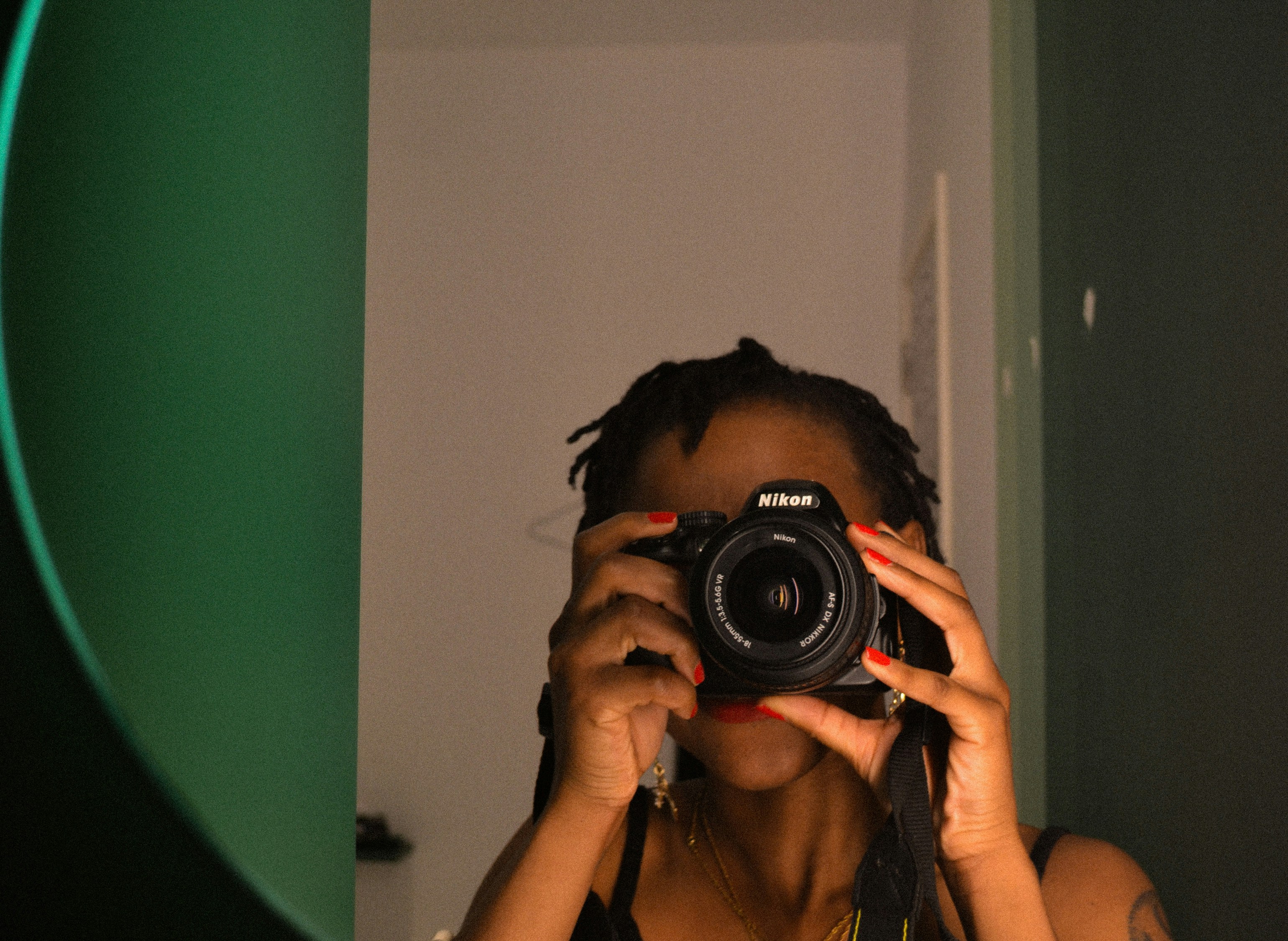 Masked by the Lens: A Self-Pocused Moment in a Quiet Corridor