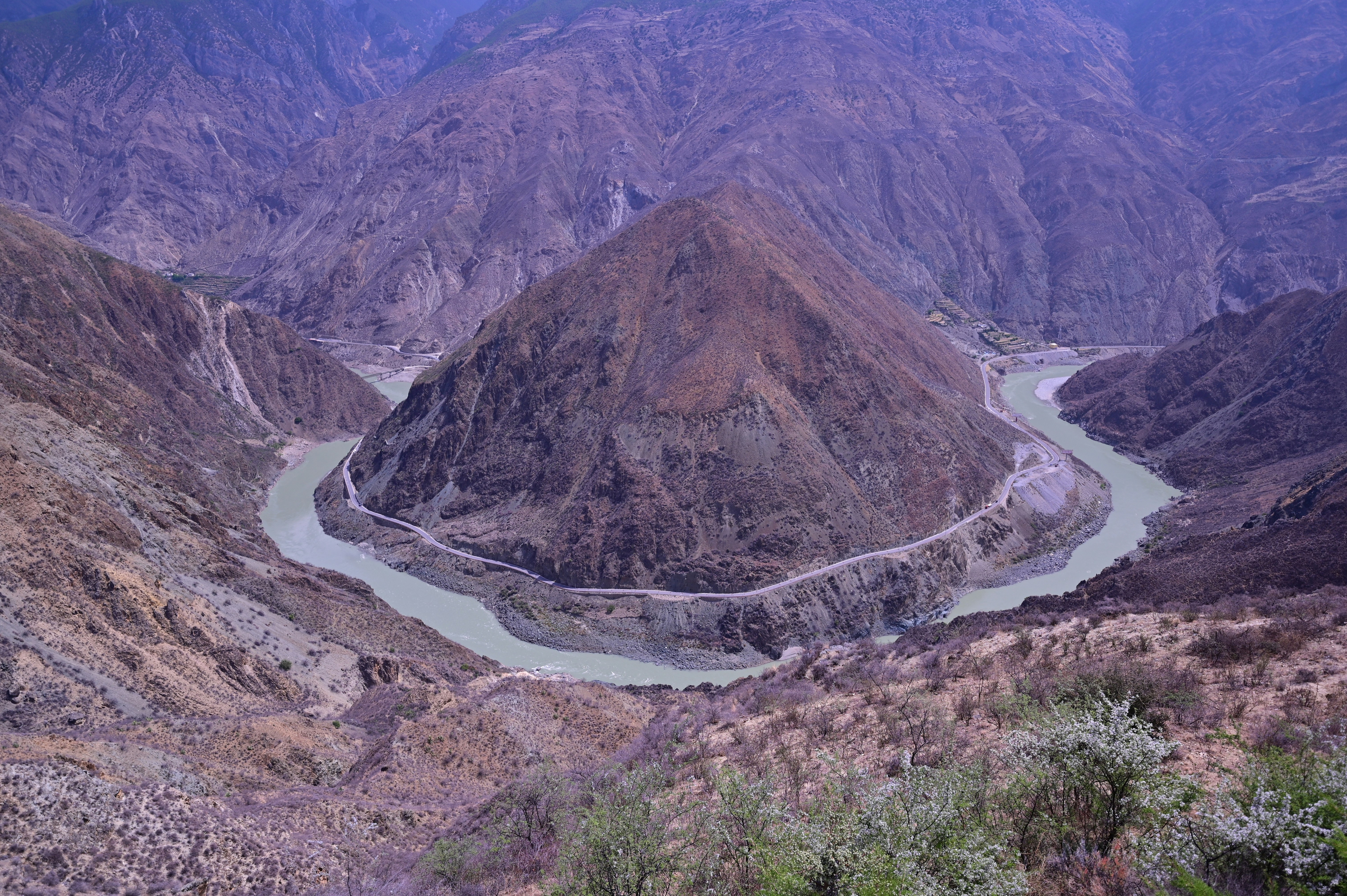 Coiled River Canyon: A Serpentine Vein Through Desert Peaks
