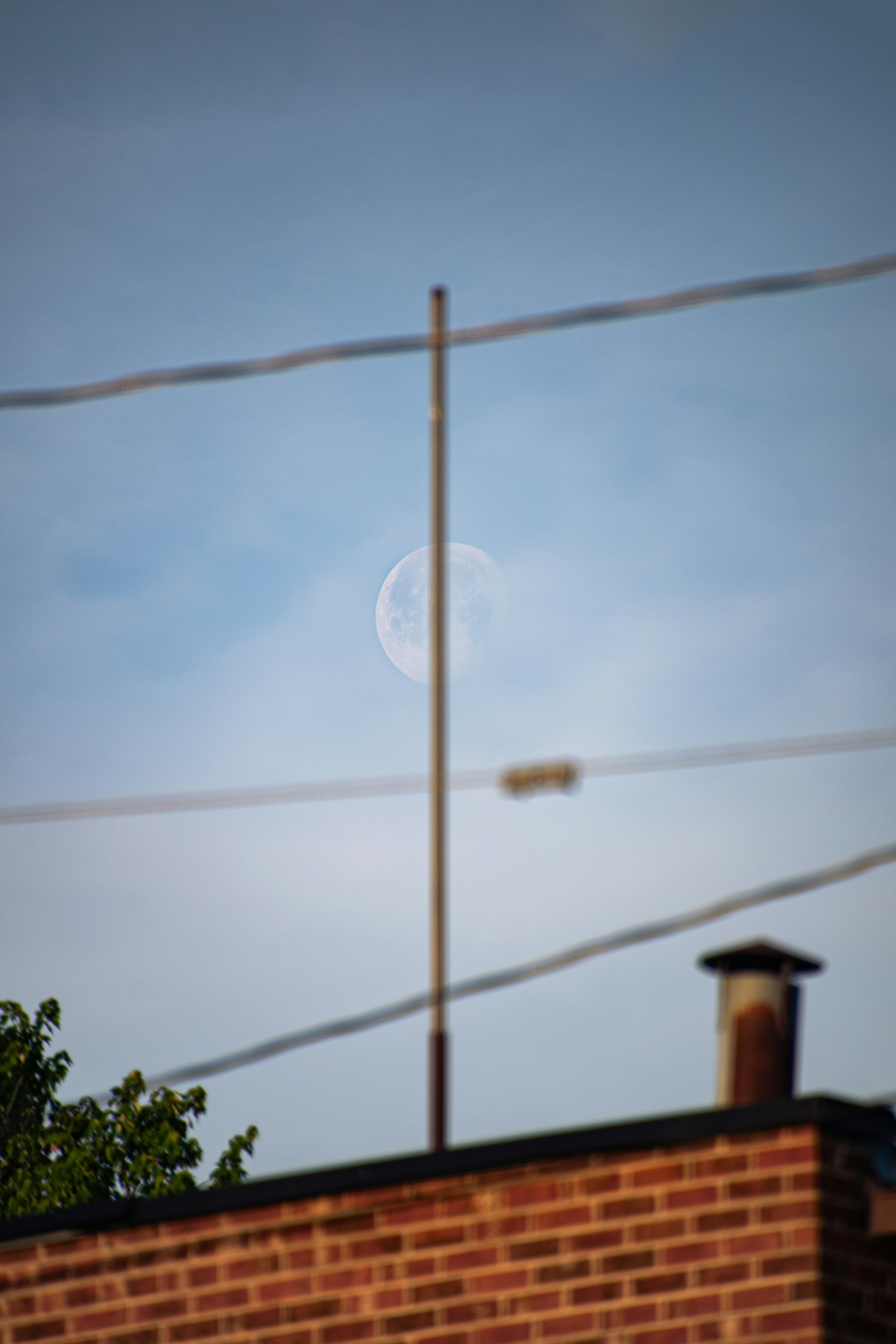 Moon Above the Rooftop Barbed Wire