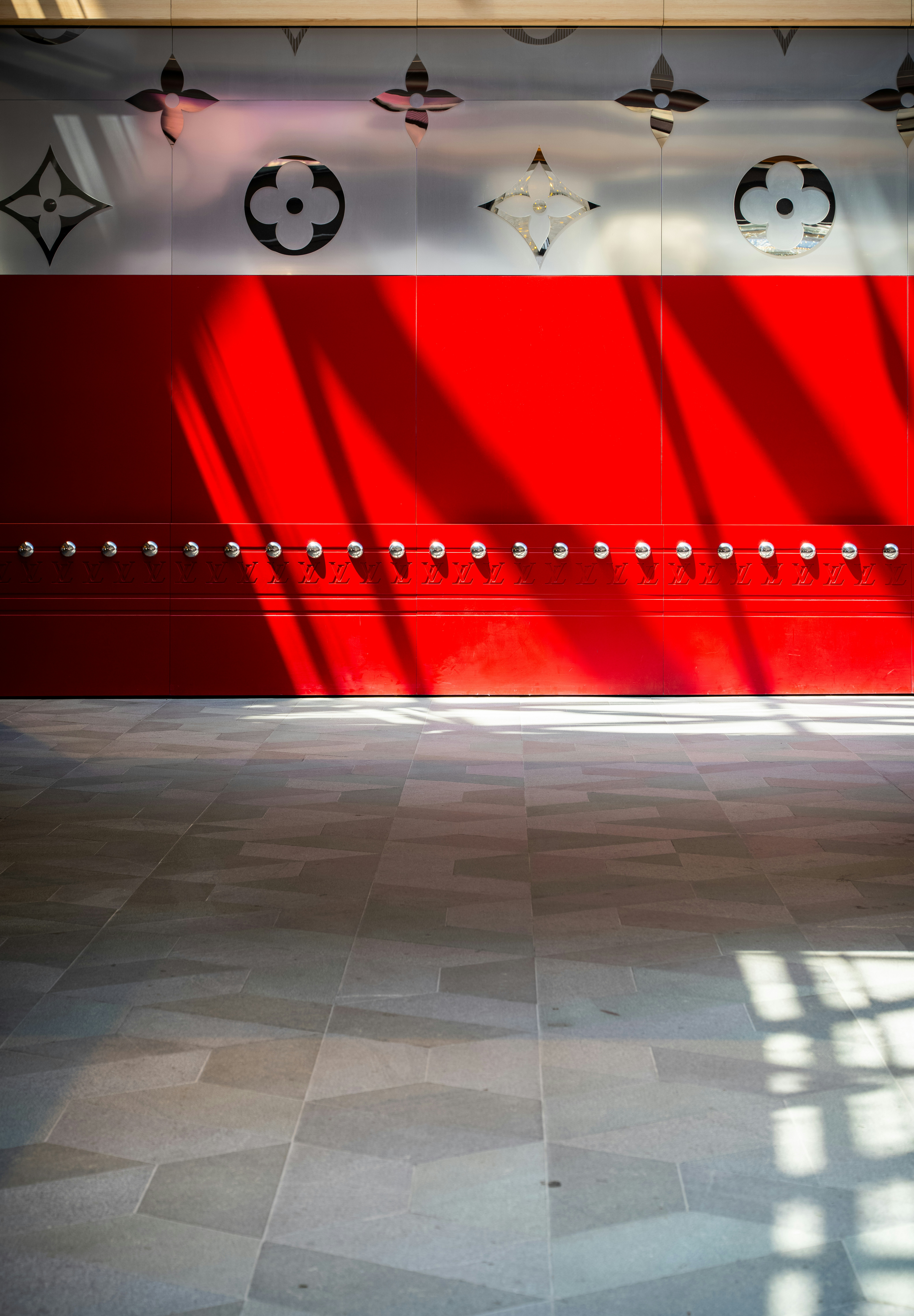 Red Rhythm: Patterns of Light and Symbol in a Modern facade