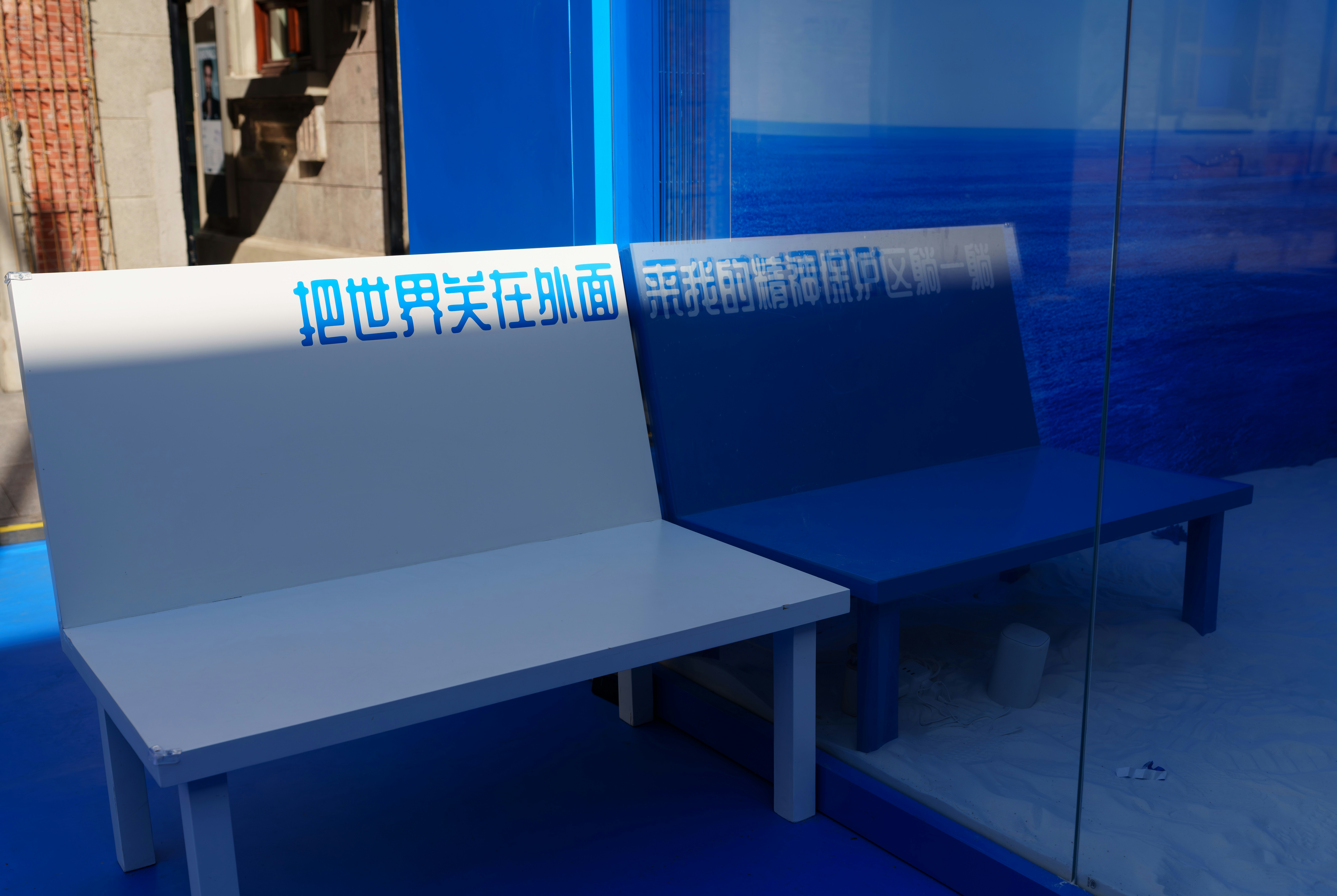 Blue Seating at a Glass-Wided Corner
