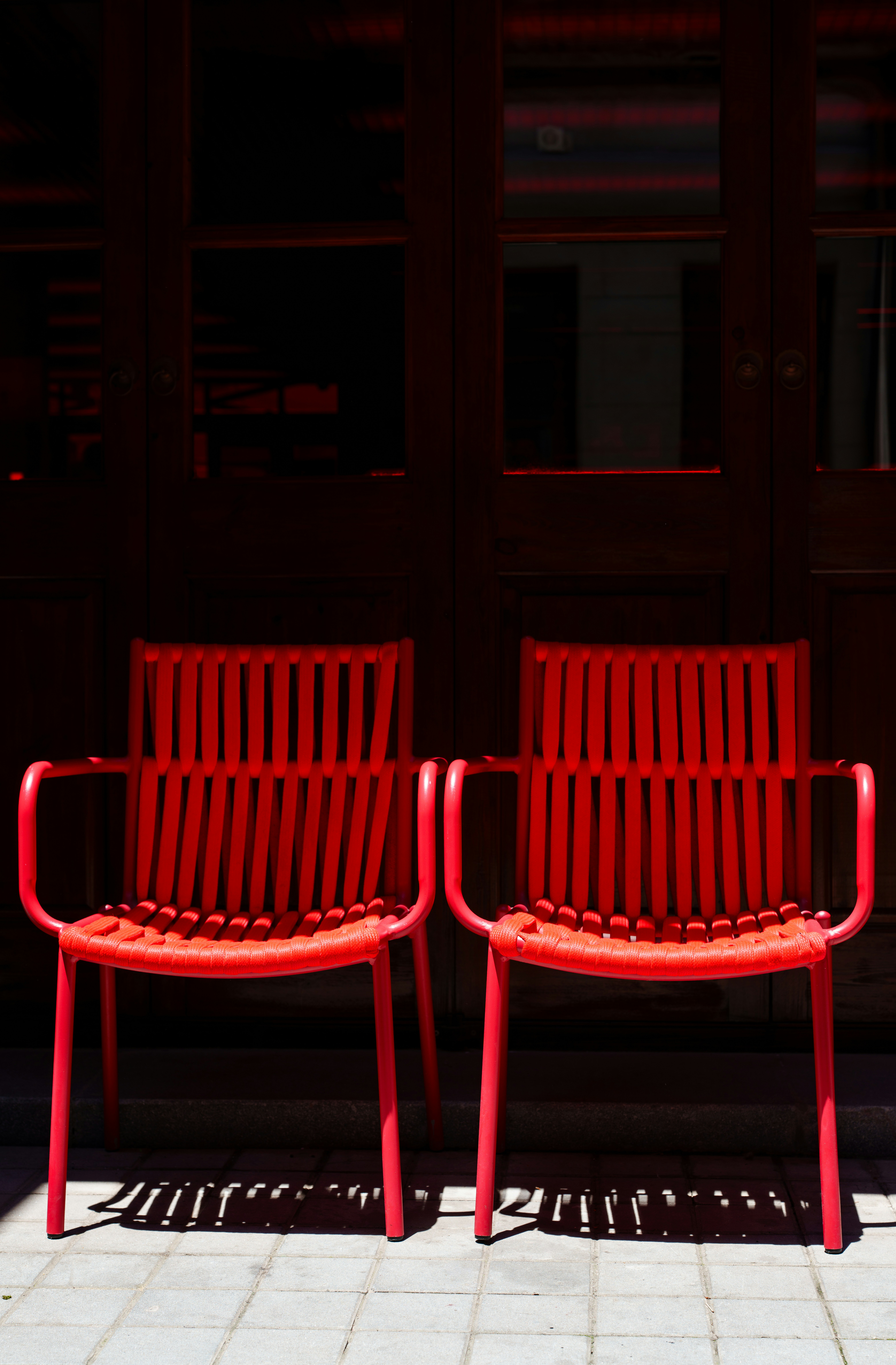 Red Chairs in Sunset Silence