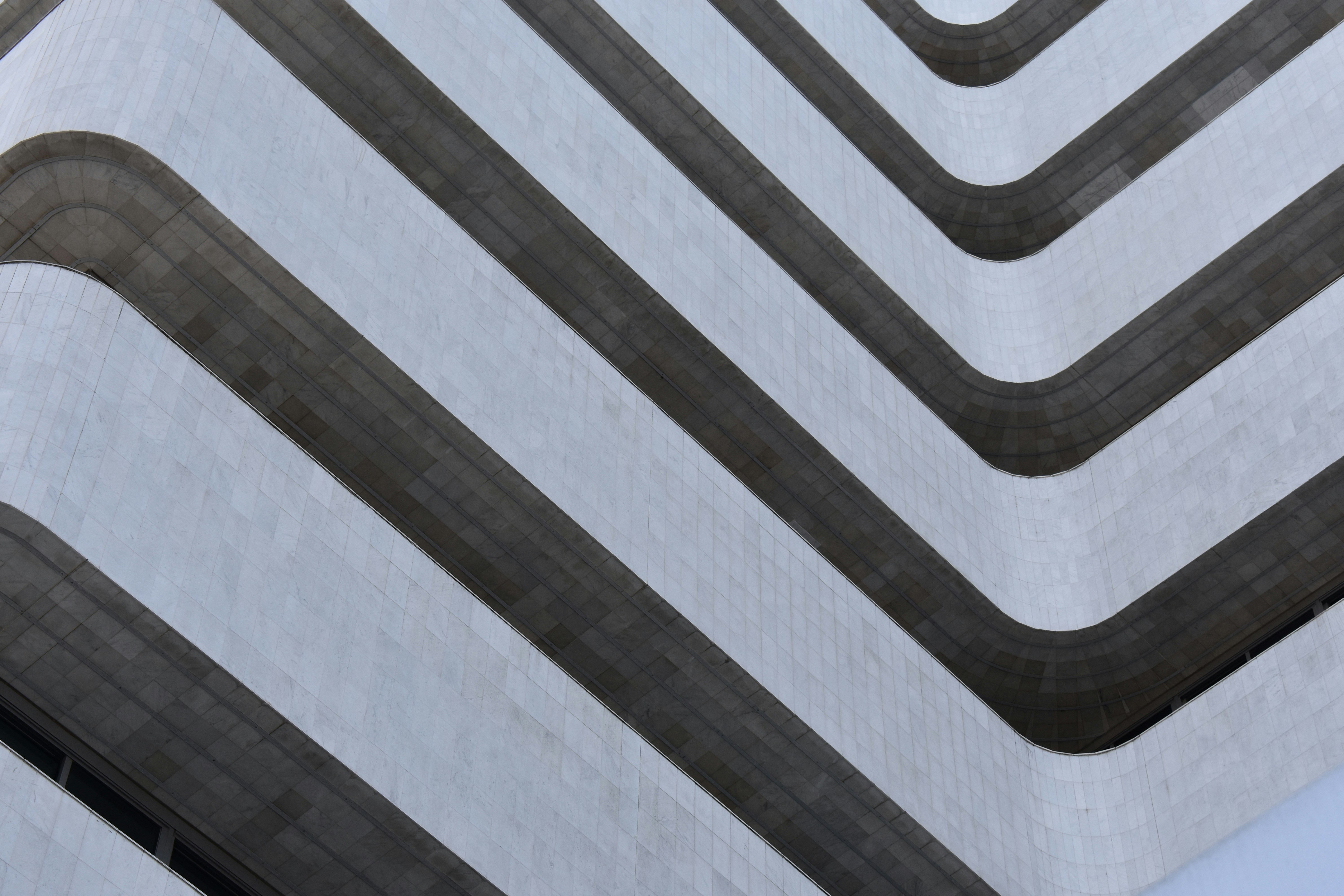 Chevron Facade: An Echo of Curved Lines in Concrete