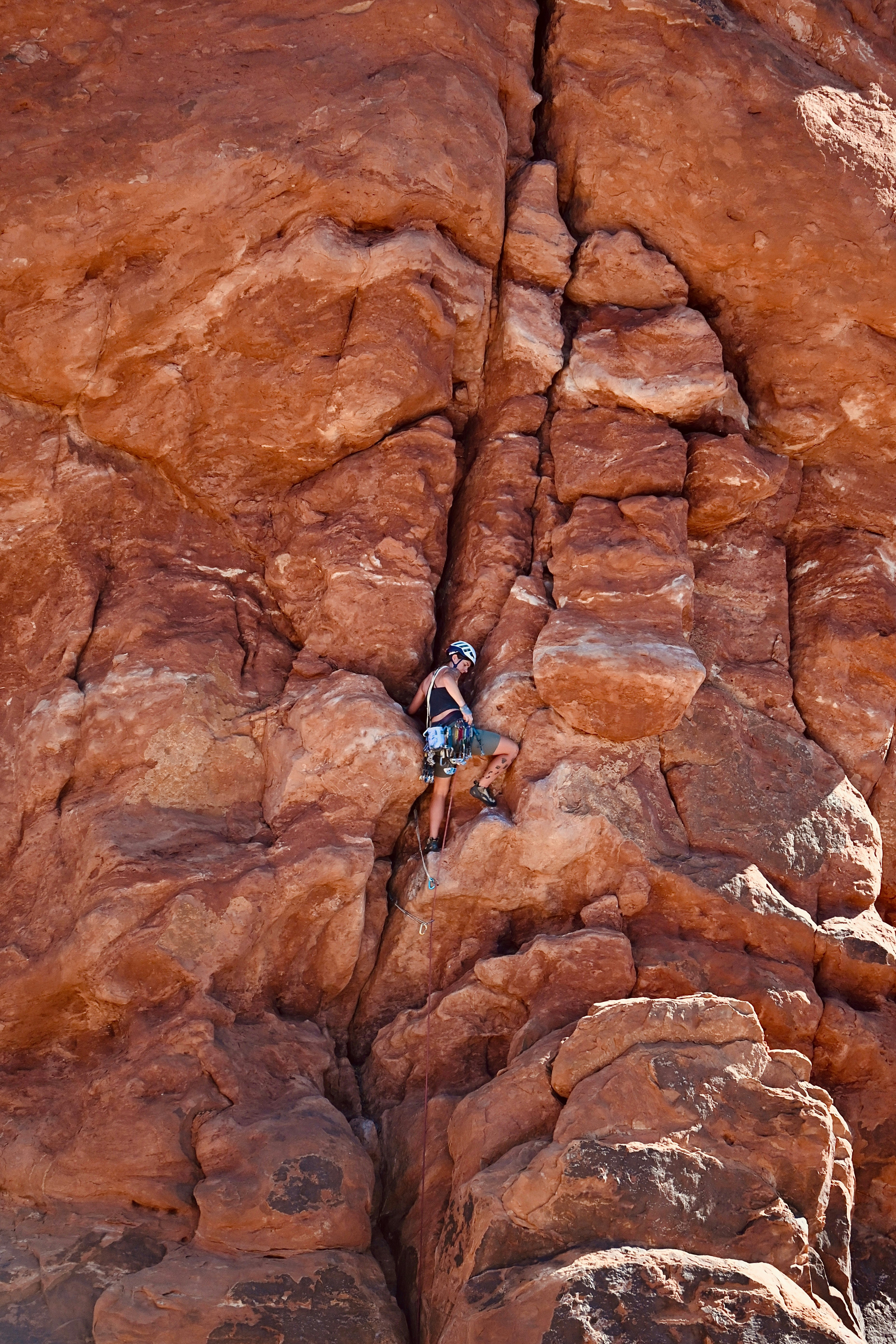 Climber Ascends a Crimson Rock Chimney