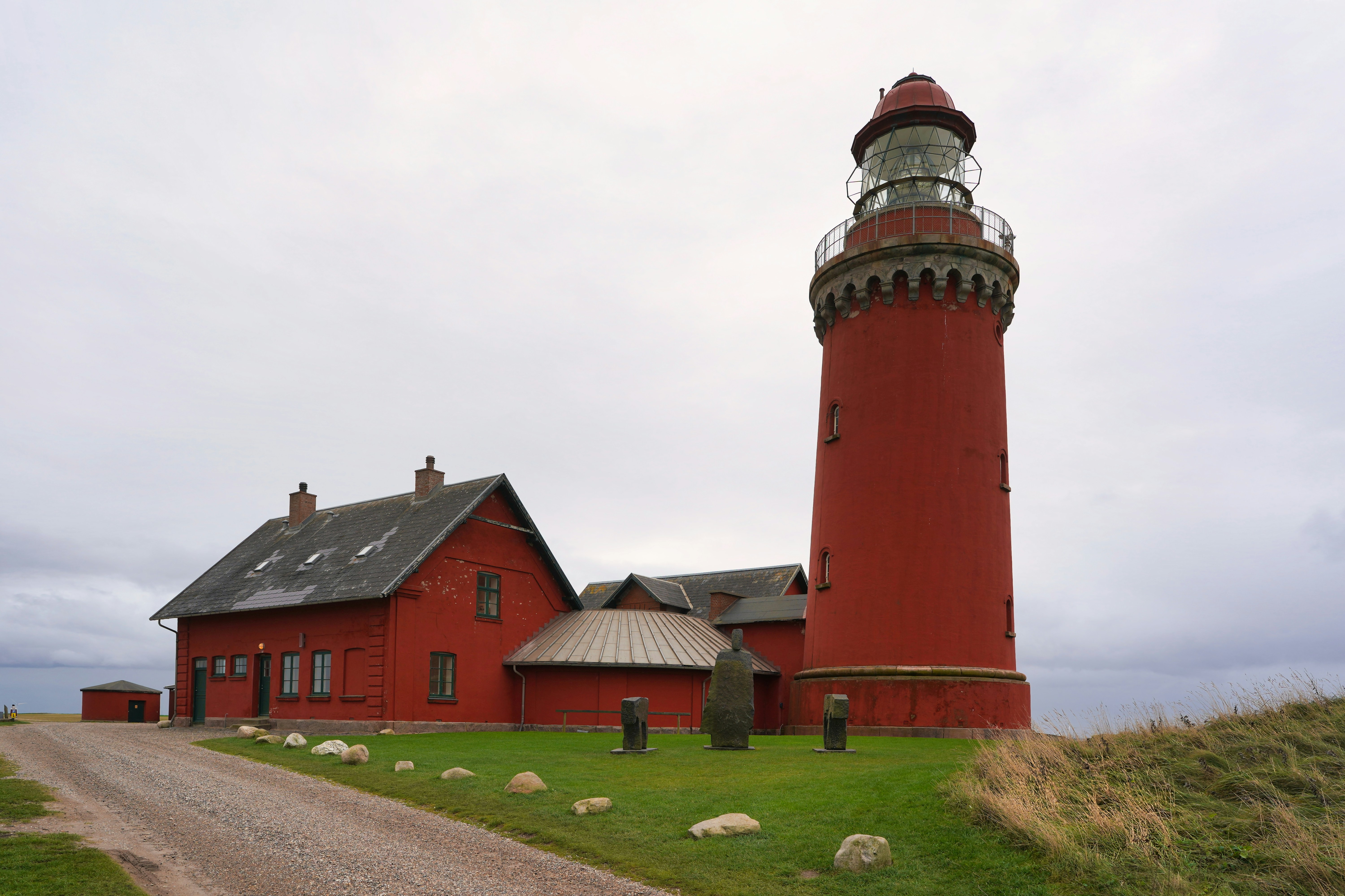 Red Beacon by the Dune: A Seaside Lighthouse Portrait