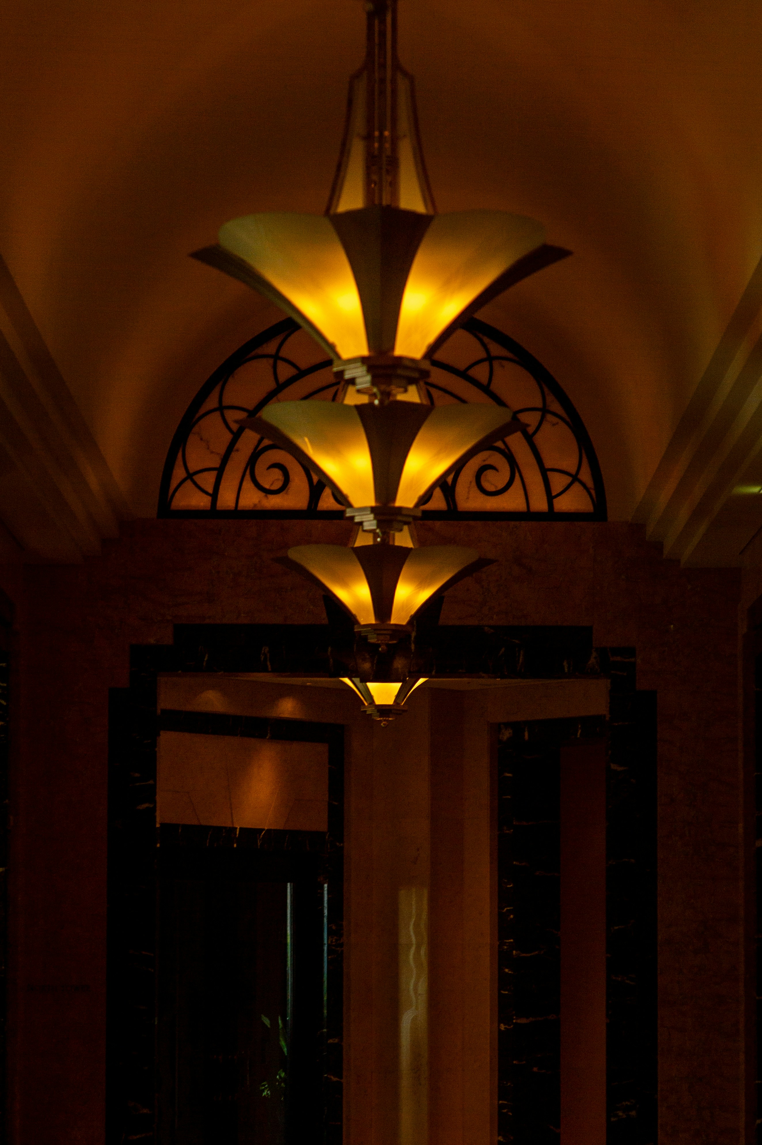 Golden Canopy: A Lofted Glow Amid Arched Ironwork