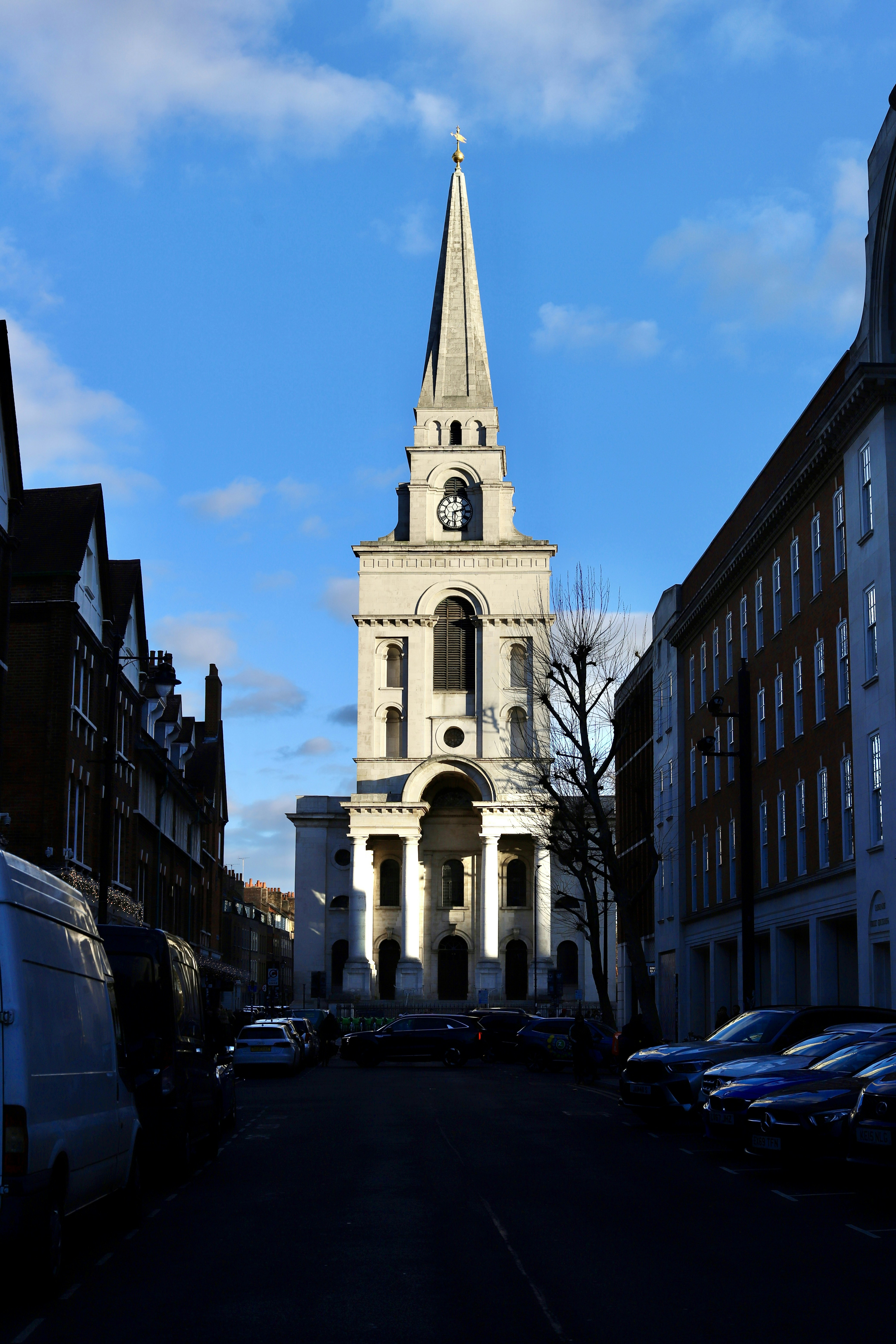 Towering Colonnade: A Sunlit Cathedral Rising Between City Walls